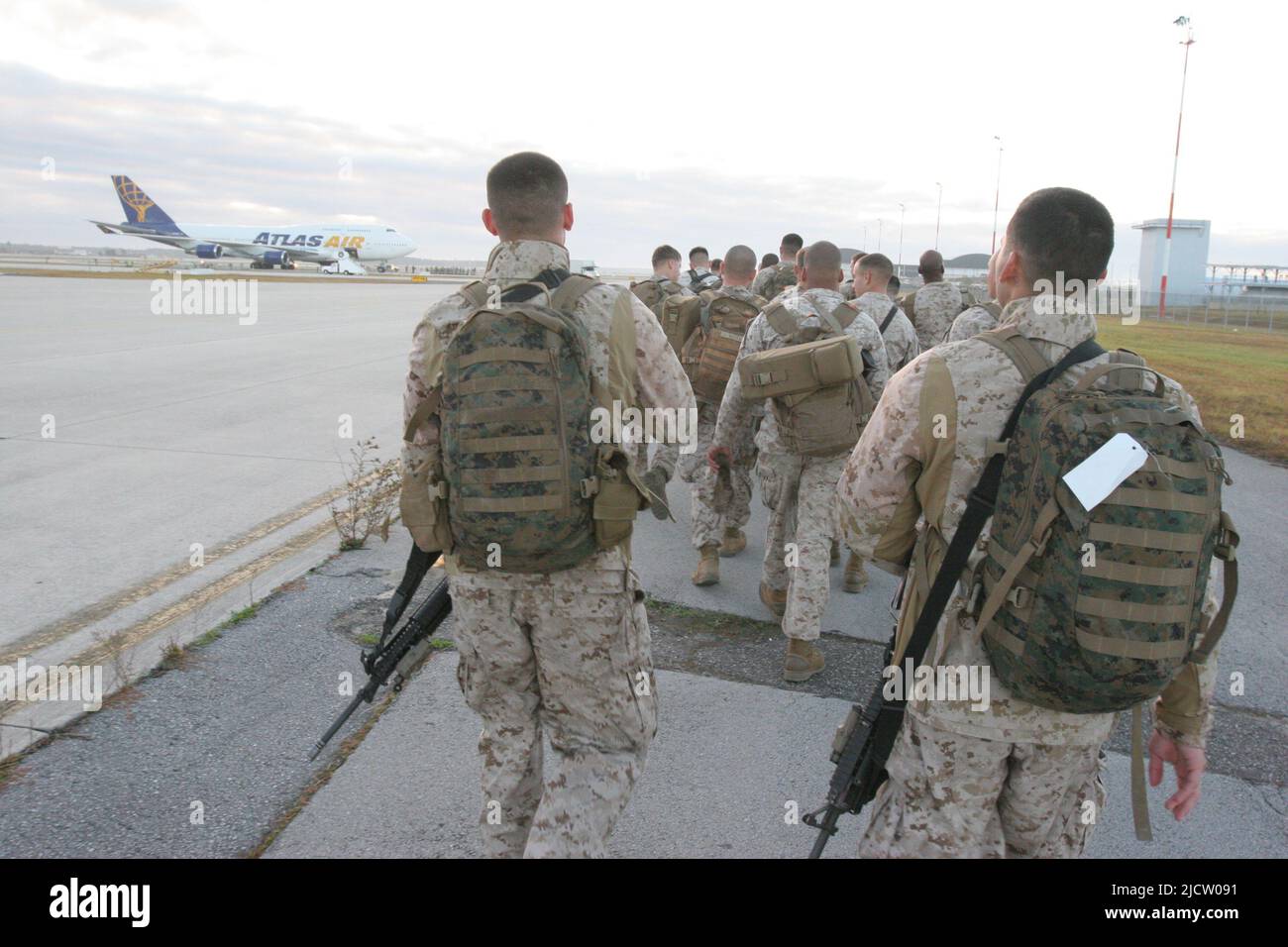 U.S. Marines with 1st Battalion, 8th Marine Regiment (1/8), 2D Marine Division, walk towards ...