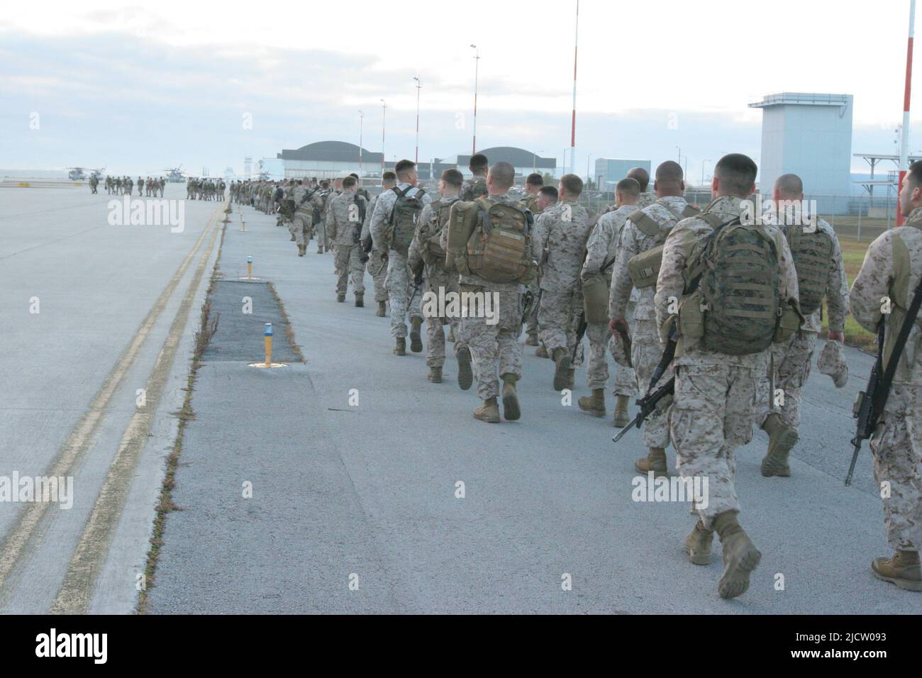U.S. Marines with 1st Battalion, 8th Marine Regiment (1/8), 2D Marine Division, walk towards ...