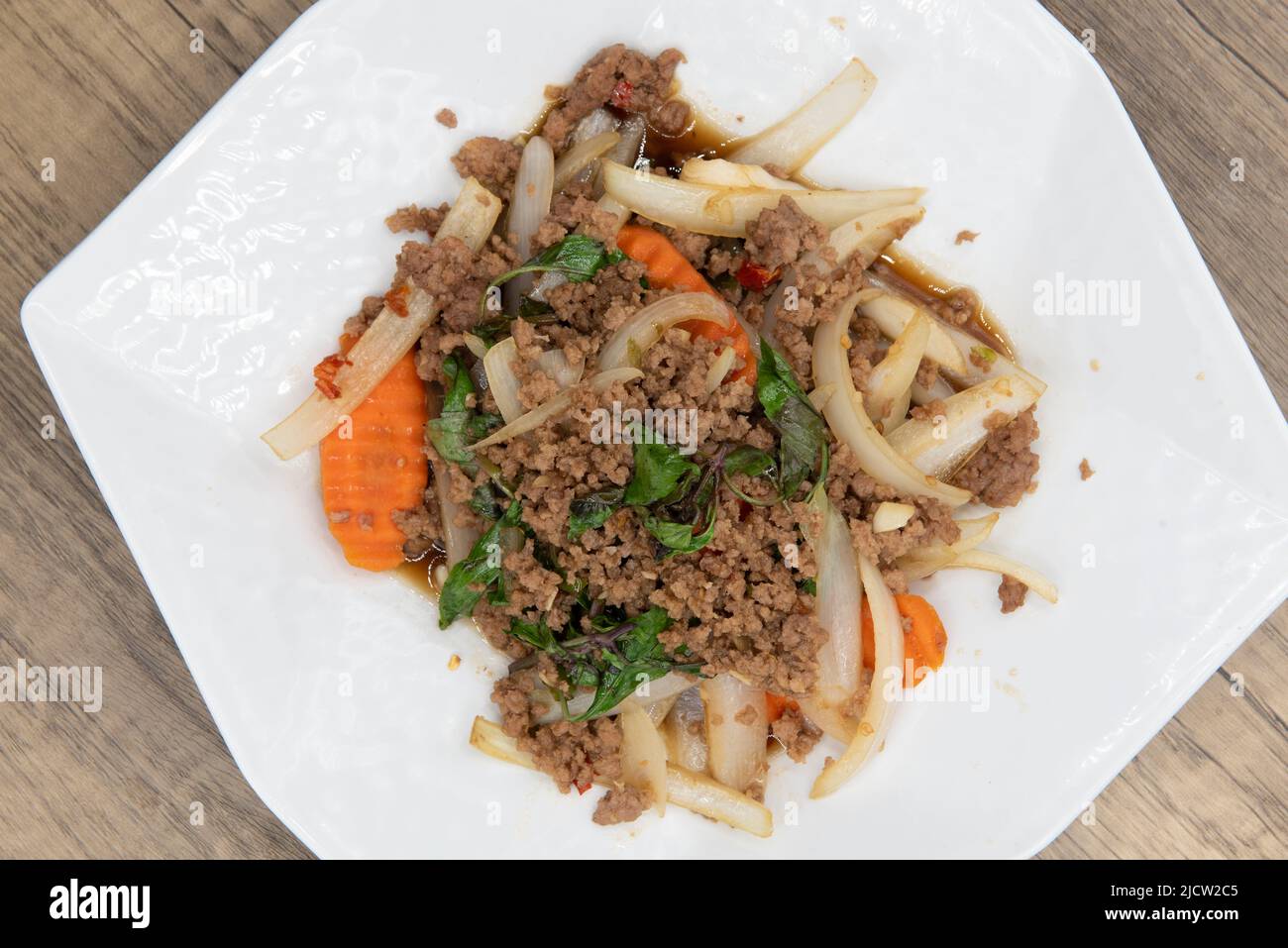 Overhead view of tasty mint leaves stir fry with decorative garnishment ...