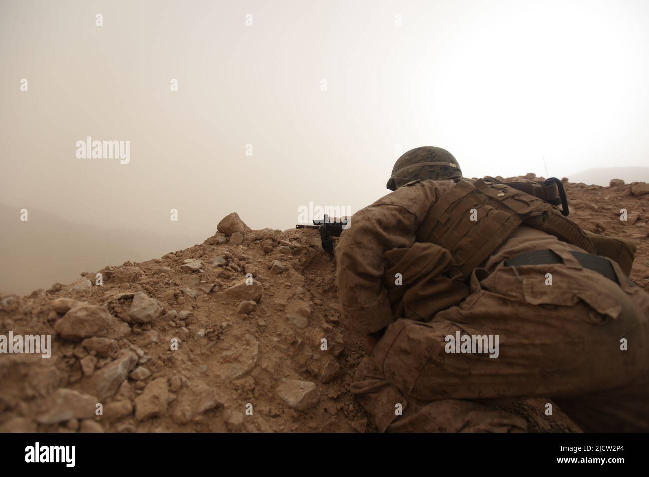 US Marines with 1st Battalion, 8th Marine Regiment return fire from ...