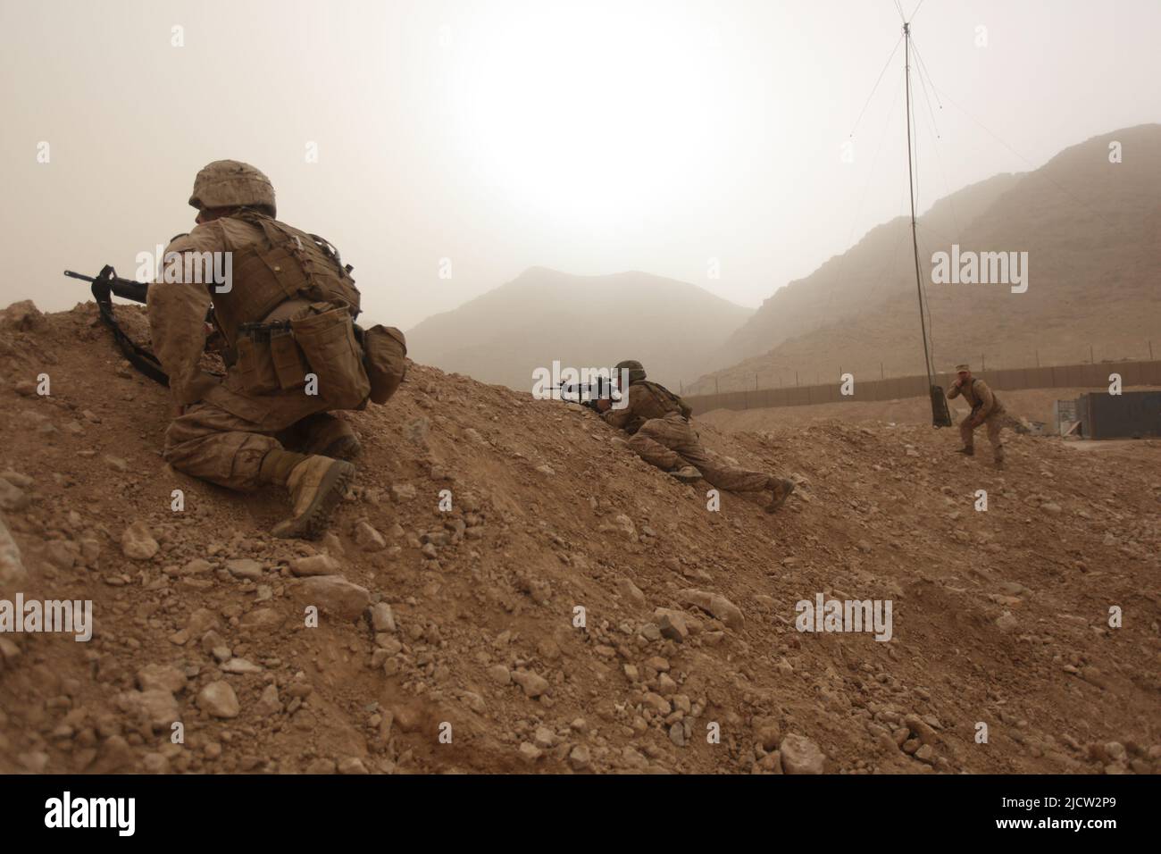 US Marines with 1st Battalion, 8th Marine Regiment return fire from ...