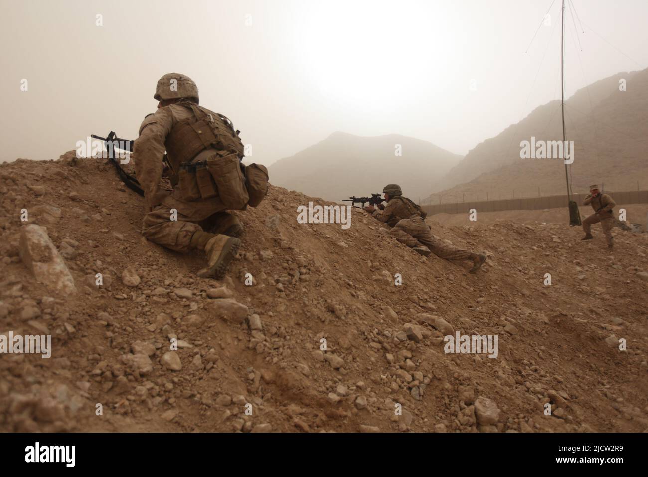 US Marines with 1st Battalion, 8th Marine Regiment return fire from ...