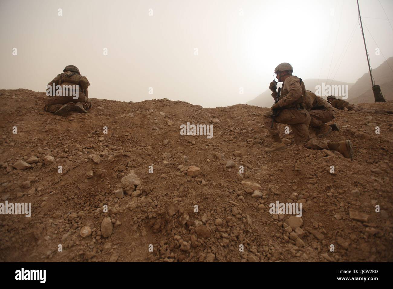US Marines with 1st Battalion, 8th Marine Regiment return fire from ...