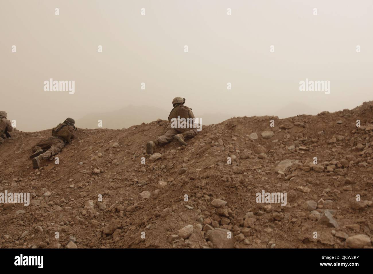 US Marines with 1st Battalion, 8th Marine Regiment return fire from ...