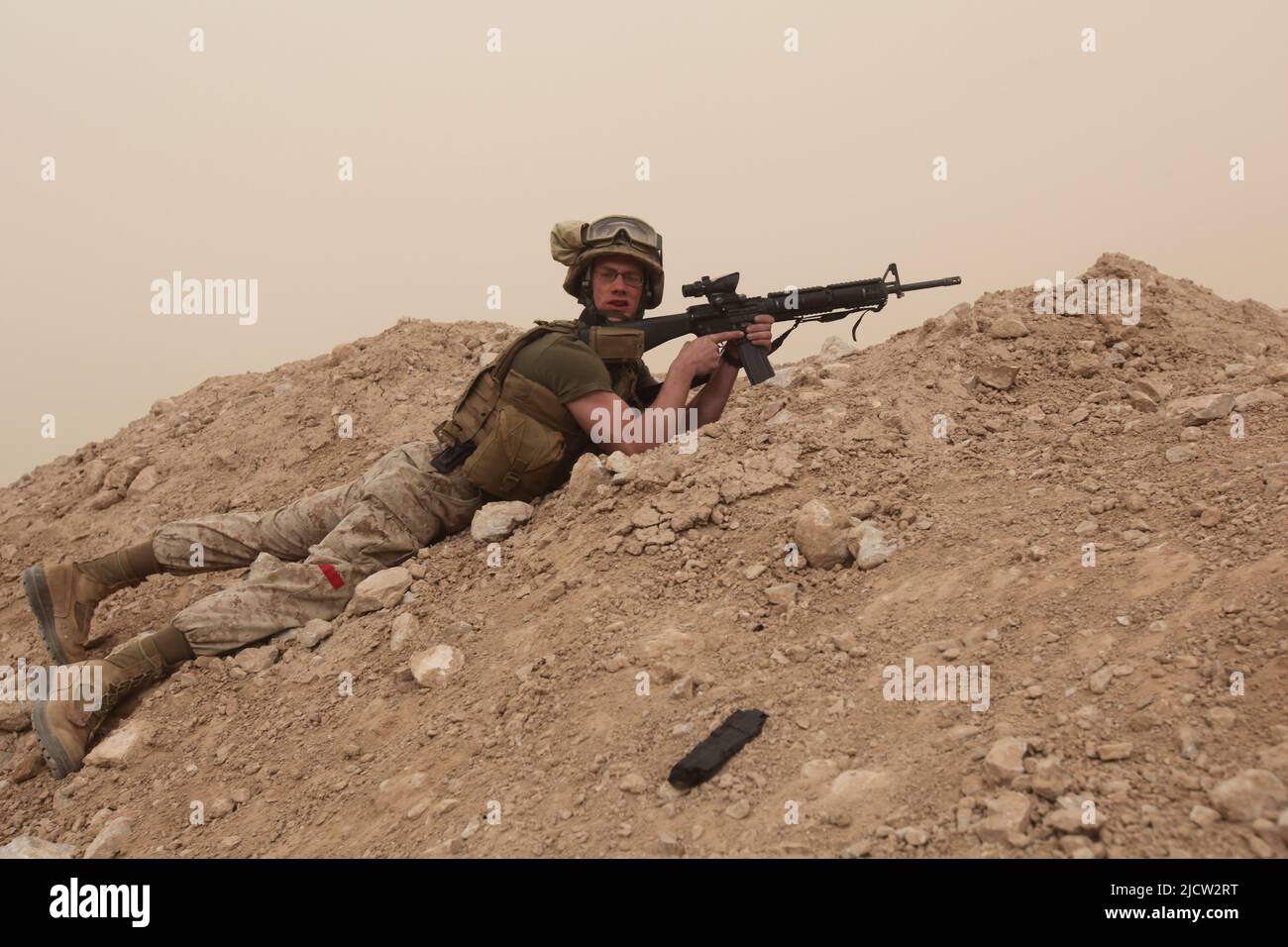US Marines with 1st Battalion, 8th Marine Regiment return fire from ...