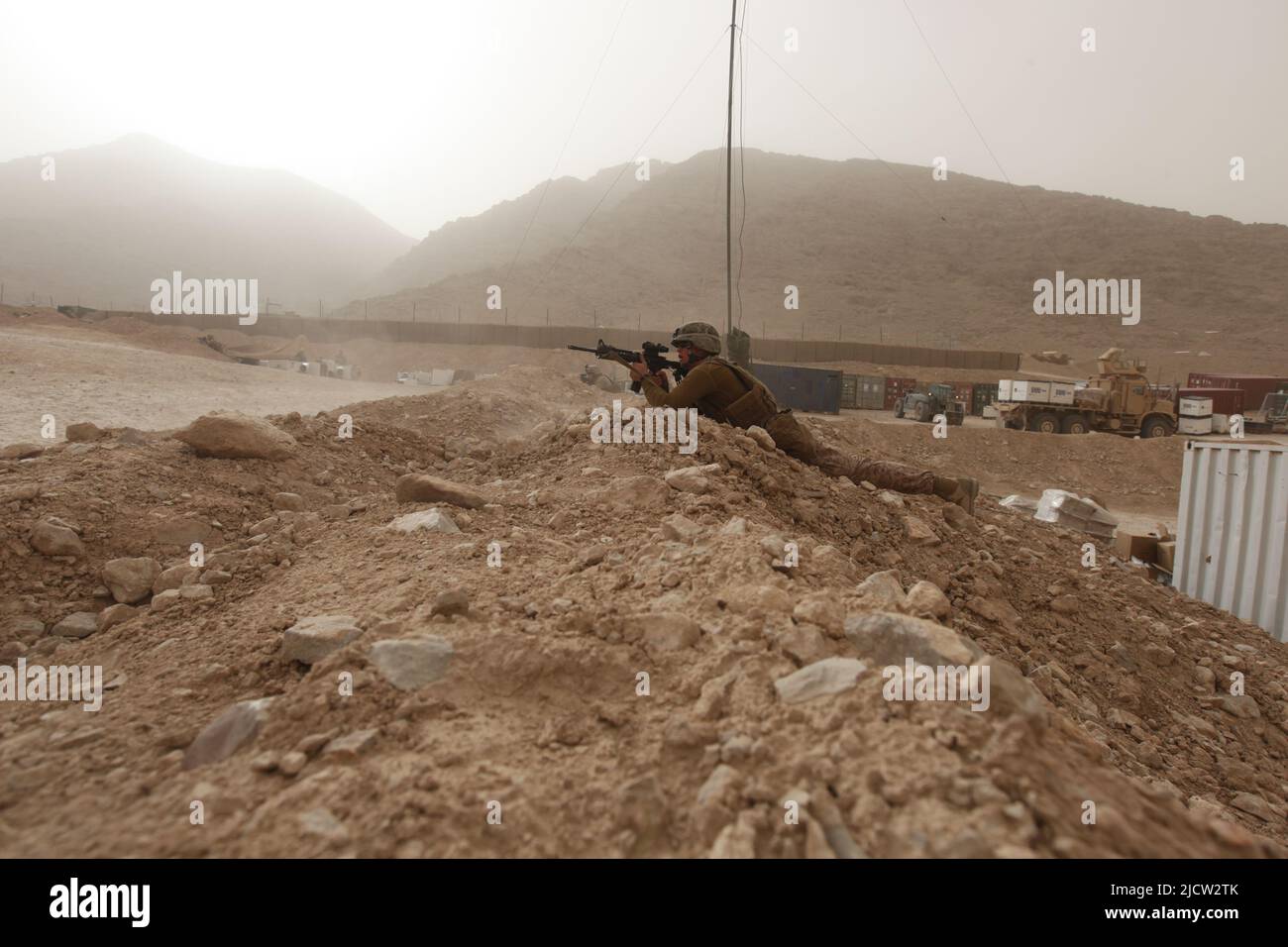 US Marines with 1st Battalion, 8th Marine Regiment return fire from ...