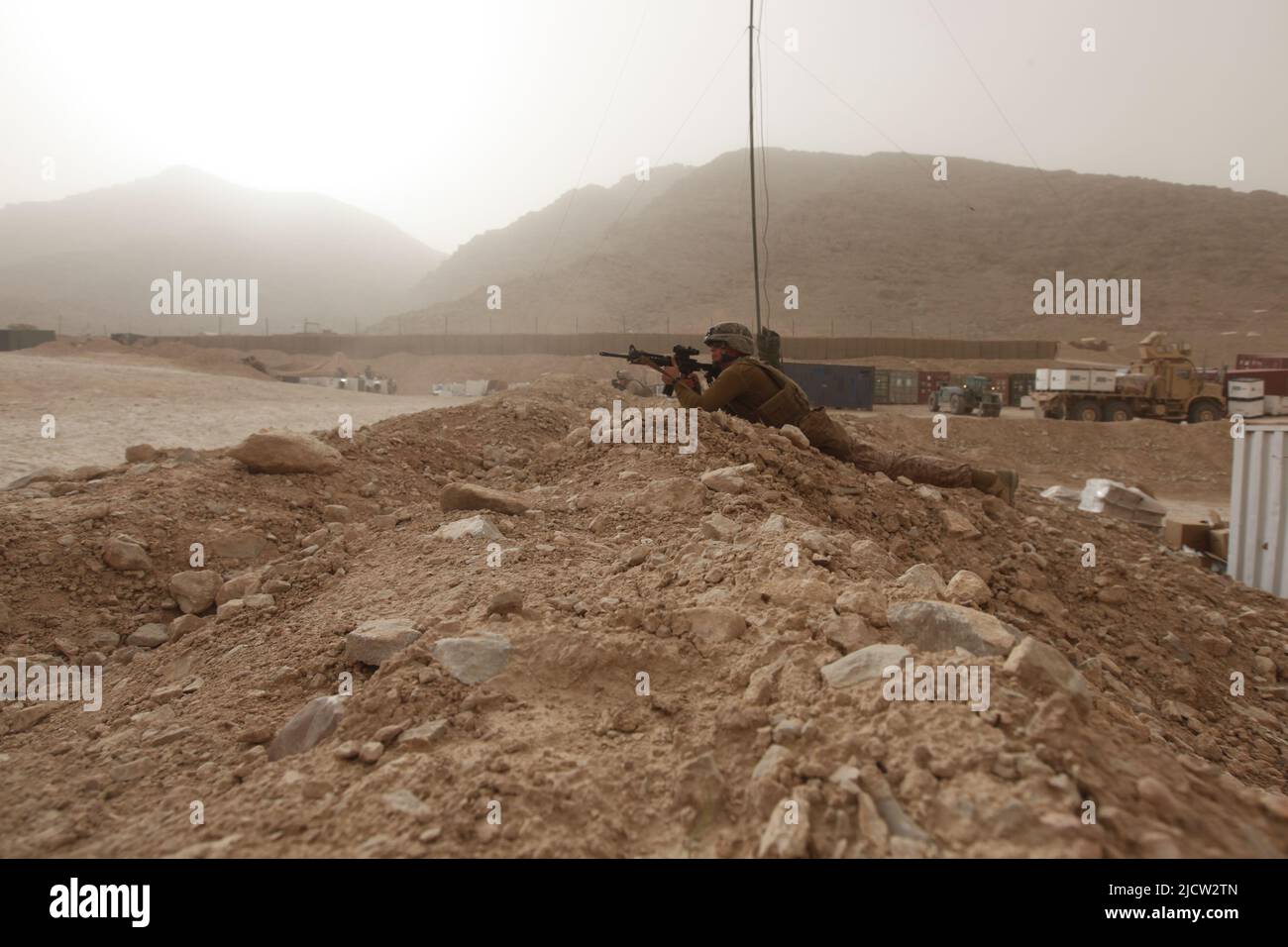 US Marines with 1st Battalion, 8th Marine Regiment return fire from ...