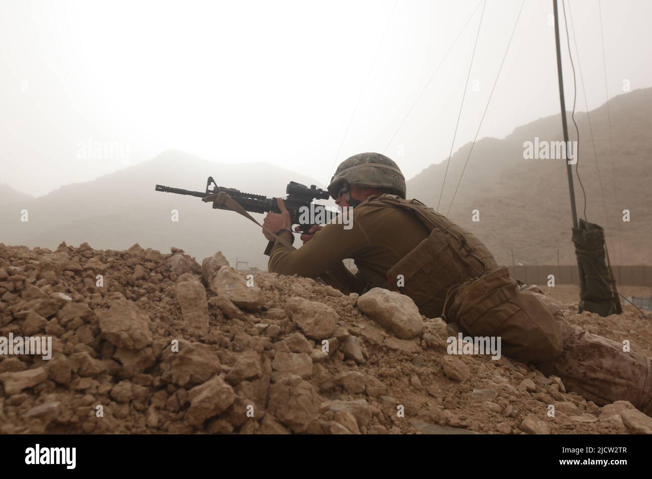 US Marines with 1st Battalion, 8th Marine Regiment return fire from ...