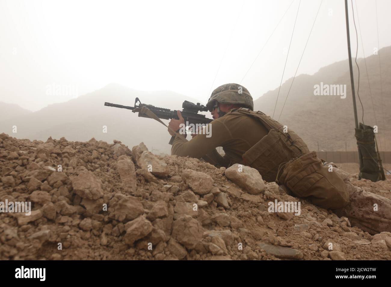 US Marines with 1st Battalion, 8th Marine Regiment return fire from ...