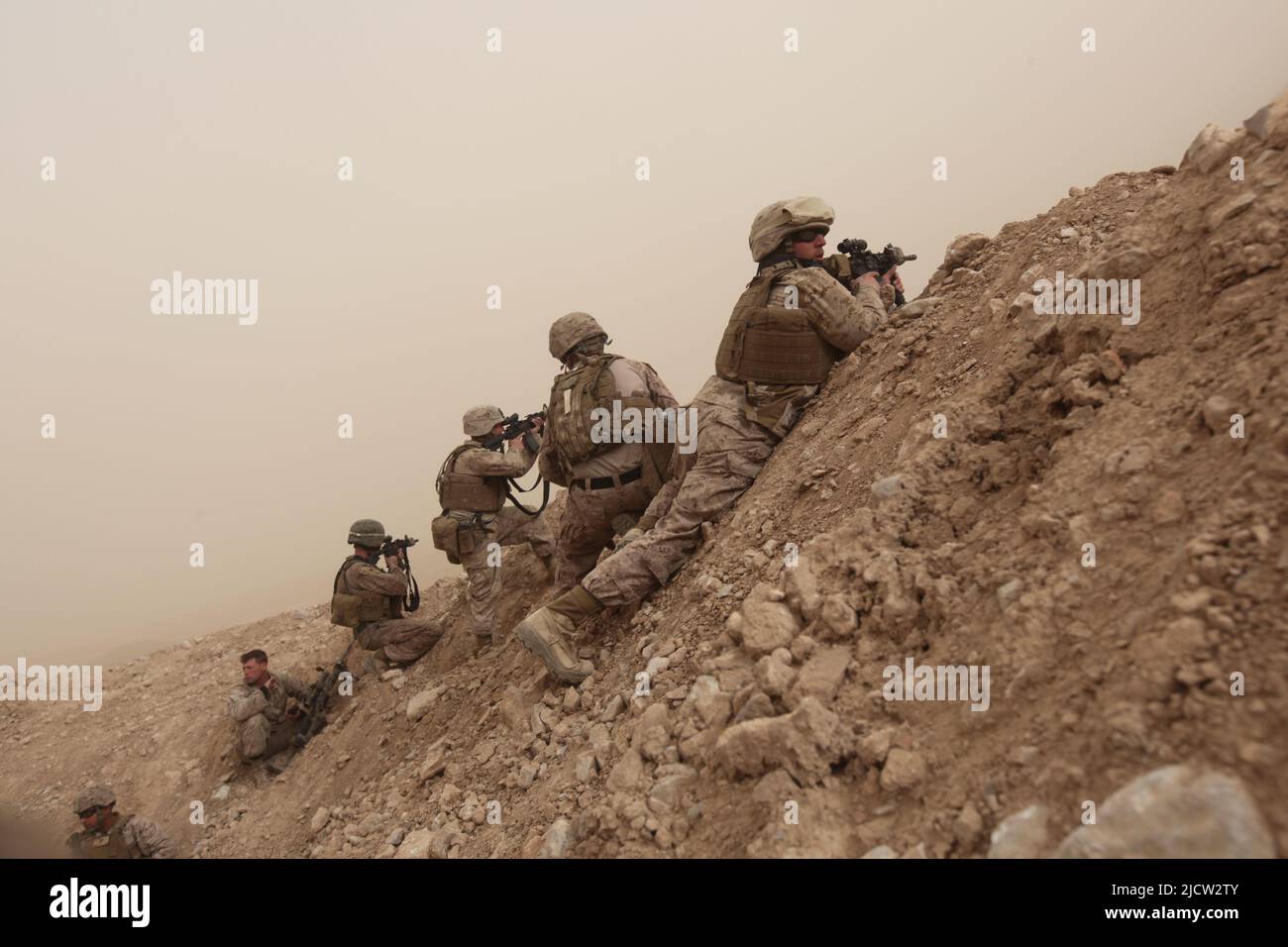 US Marines with 1st Battalion, 8th Marine Regiment return fire from ...