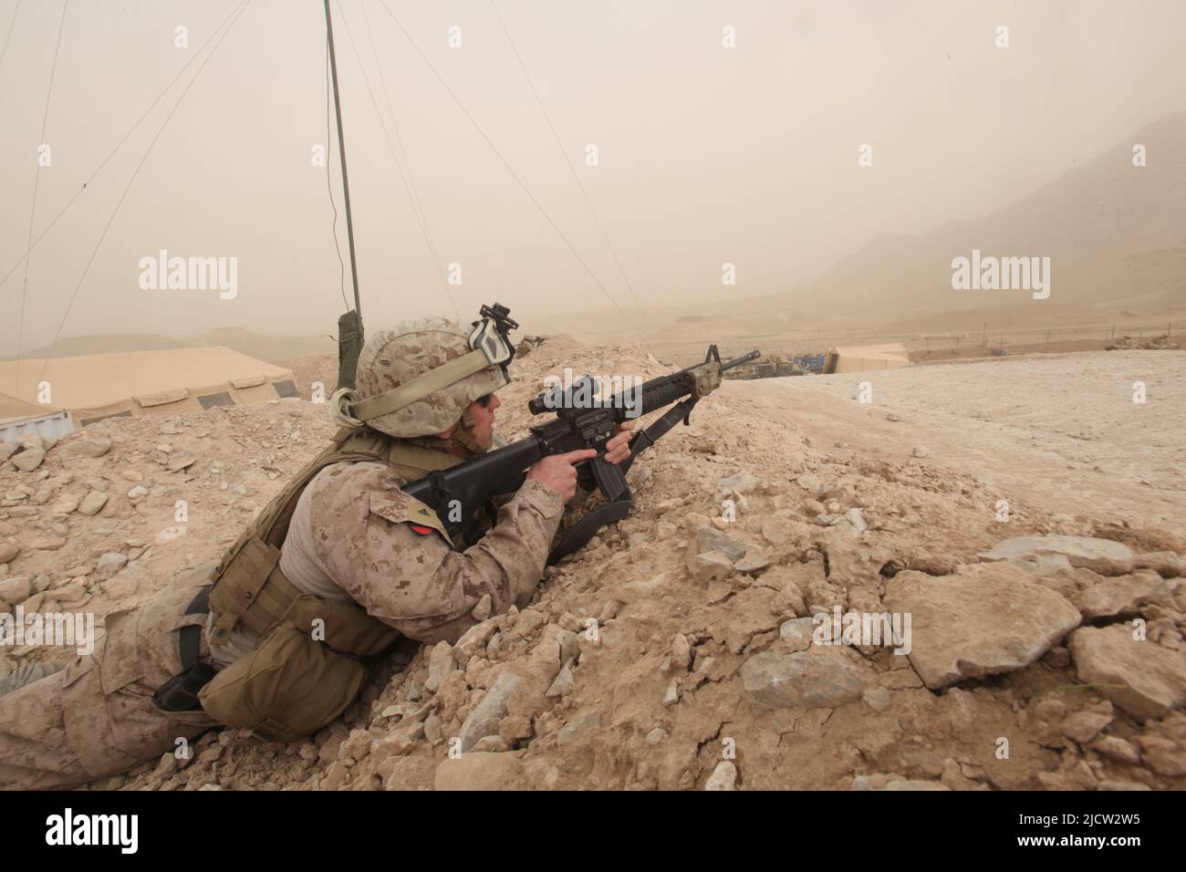 US Marines with 1st Battalion, 8th Marine Regiment return fire from ...