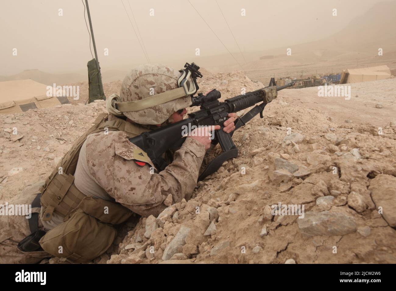 US Marines with 1st Battalion, 8th Marine Regiment return fire from ...