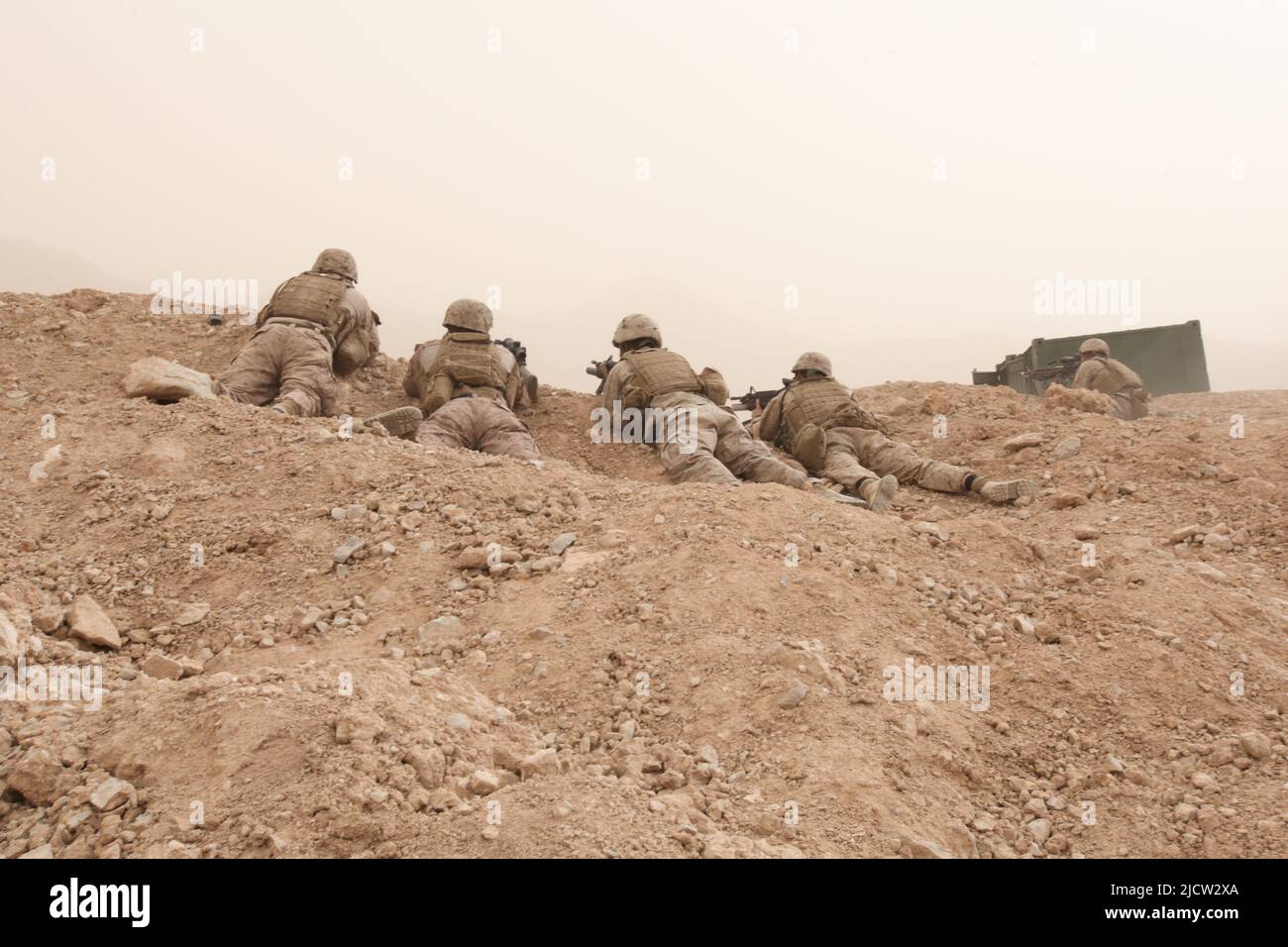 US Marines with 1st Battalion, 8th Marine Regiment return fire from ...