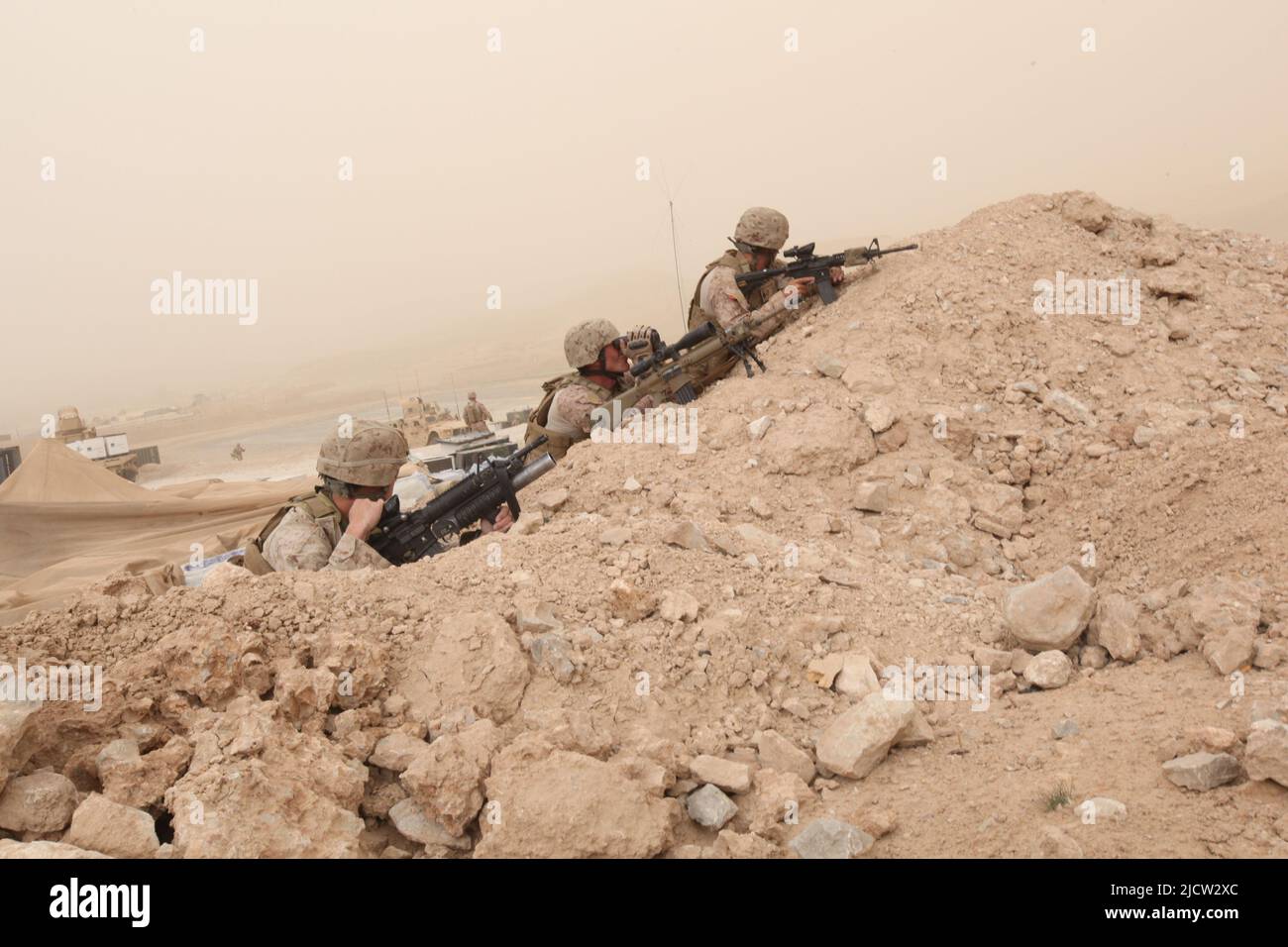 US Marines with 1st Battalion, 8th Marine Regiment return fire from ...