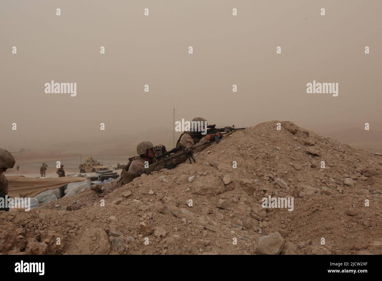 US Marines with 1st Battalion, 8th Marine Regiment return fire from ...