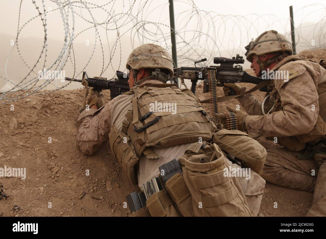 US Marines with 1st Battalion, 8th Marine Regiment return fire from ...