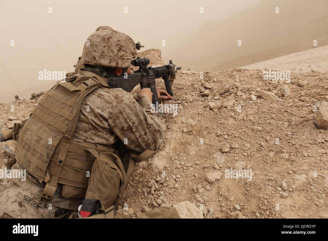 US Marines with 1st Battalion, 8th Marine Regiment return fire from ...