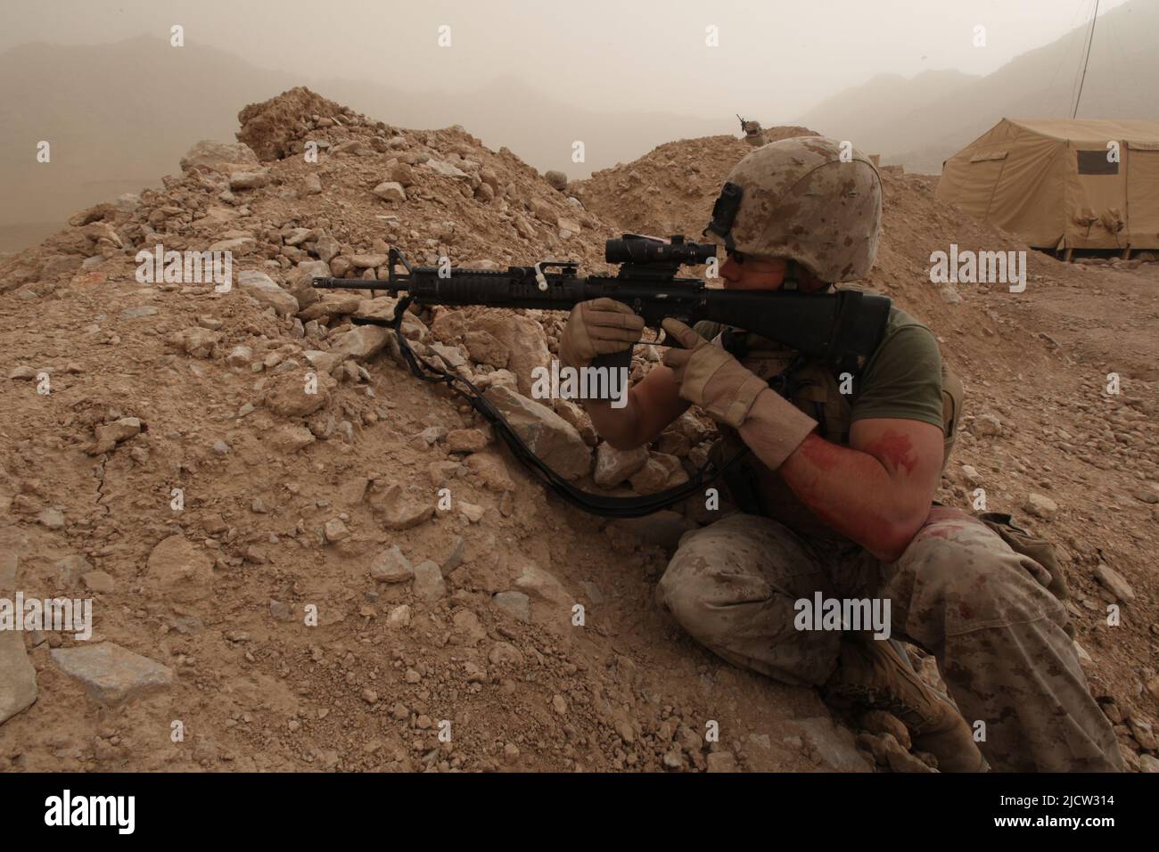 US Marines with 1st Battalion, 8th Marine Regiment return fire from ...