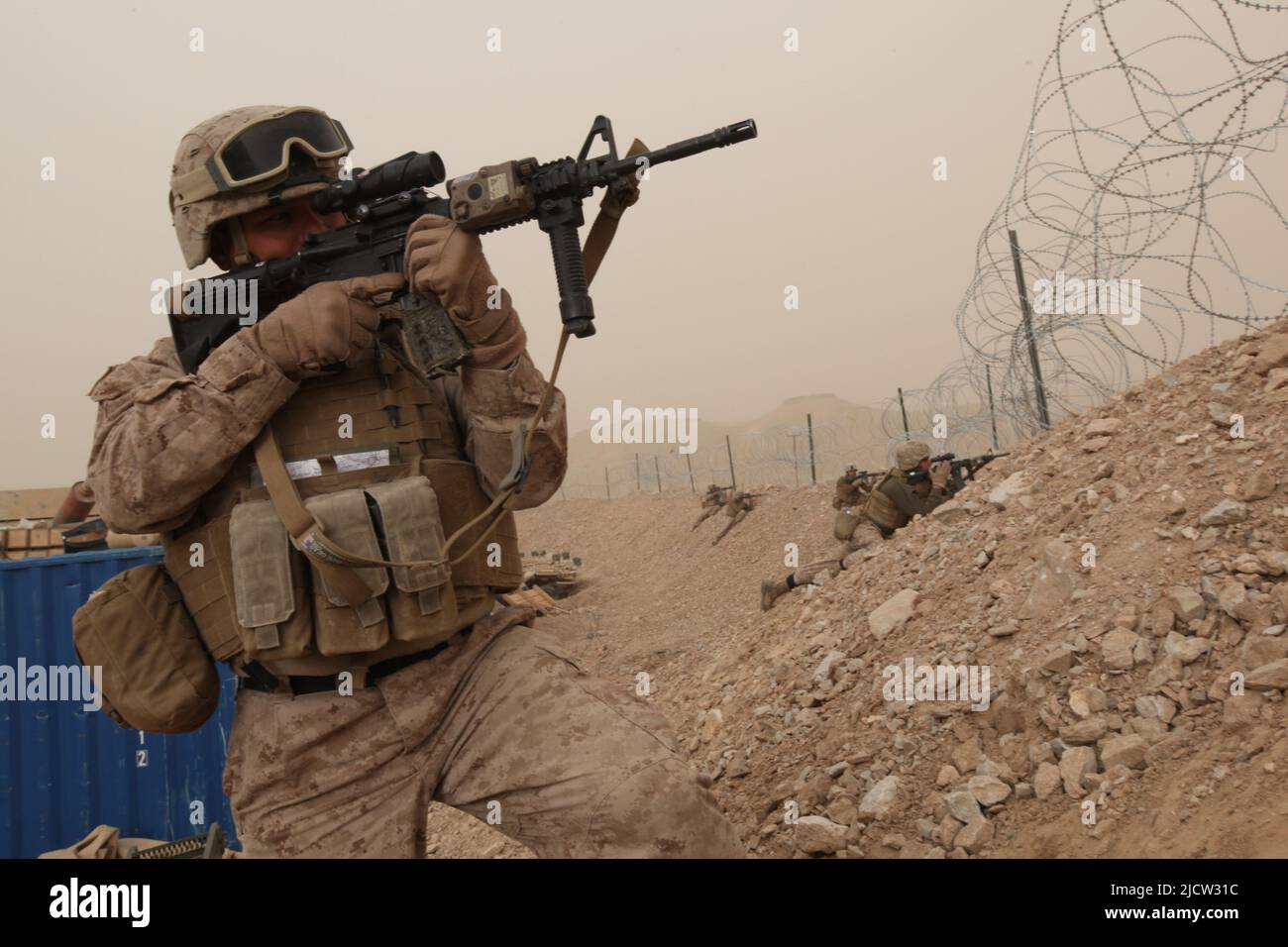 US Marines with 1st Battalion, 8th Marine Regiment return fire from ...
