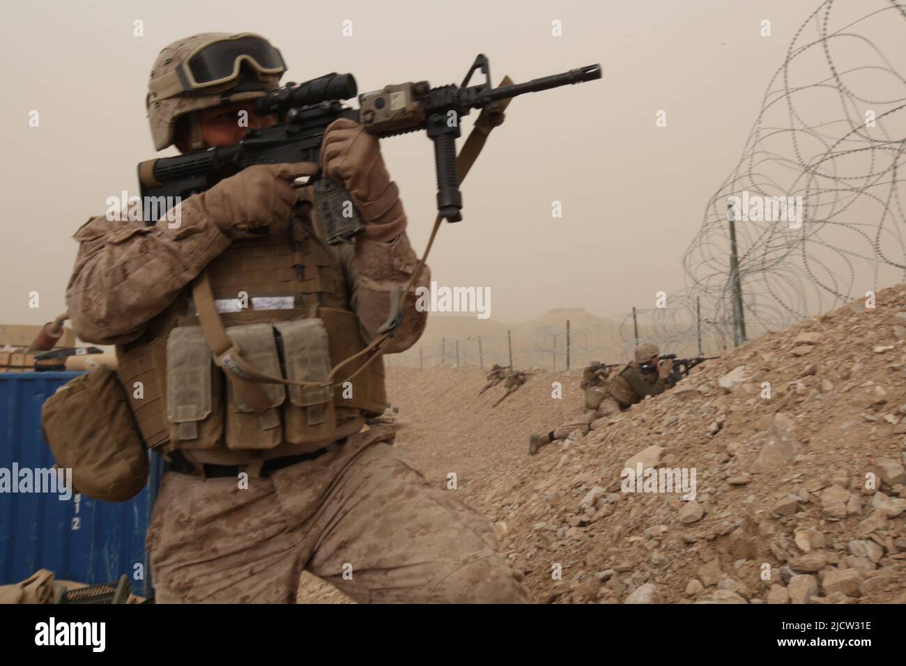 US Marines with 1st Battalion, 8th Marine Regiment return fire from ...