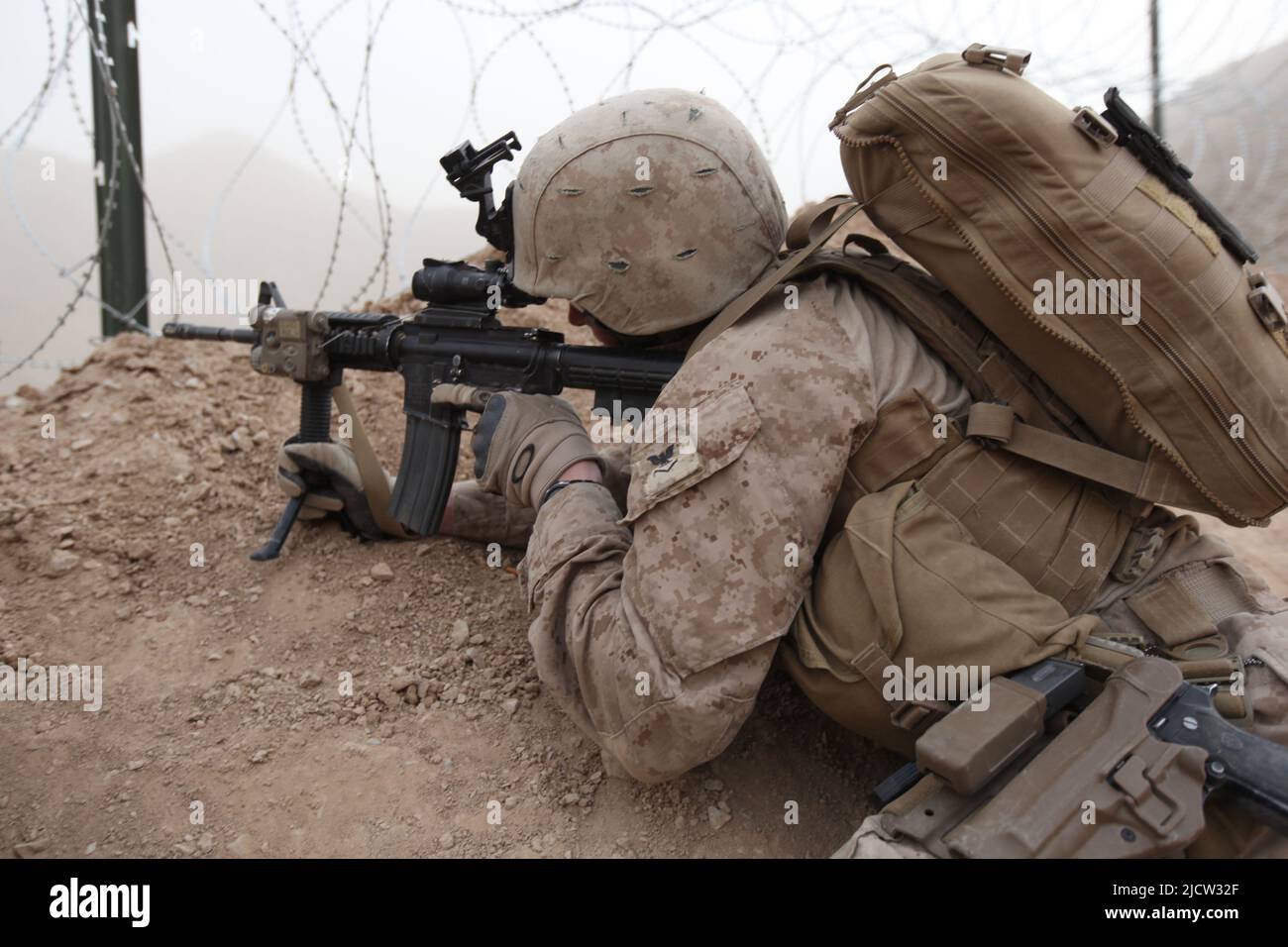US Marines with 1st Battalion, 8th Marine Regiment return fire from ...
