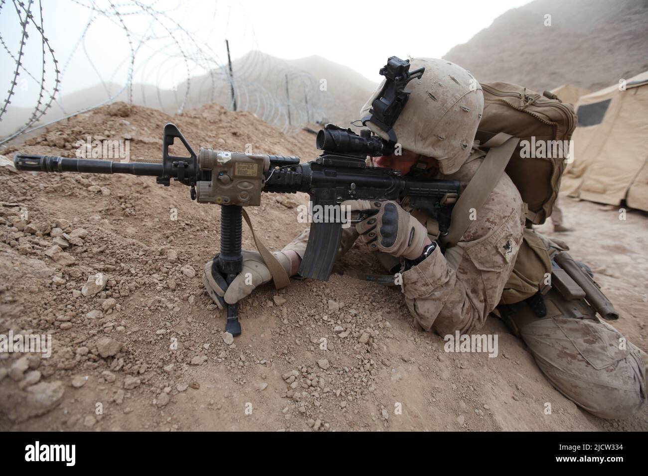 US Marines with 1st Battalion, 8th Marine Regiment return fire from ...