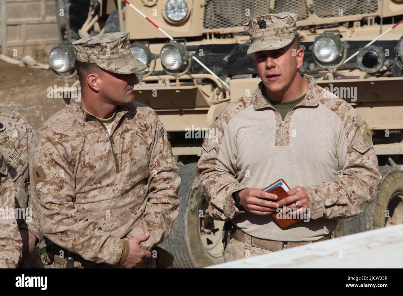 US Marines pay their respects to a fallen comrade's memorial while ...