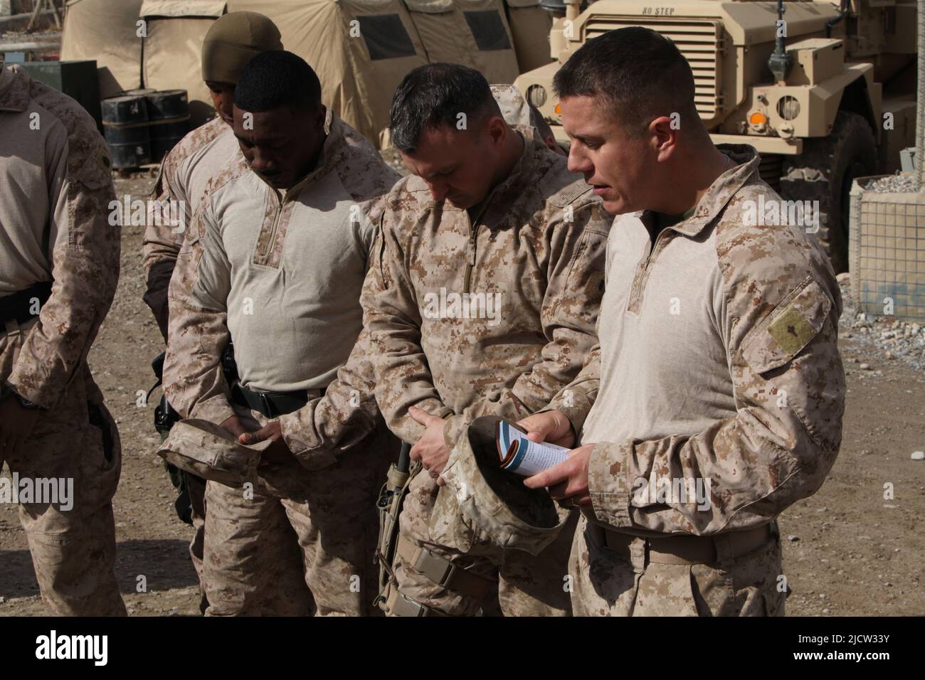 US Marines pay their respects to a fallen comrade's memorial while ...