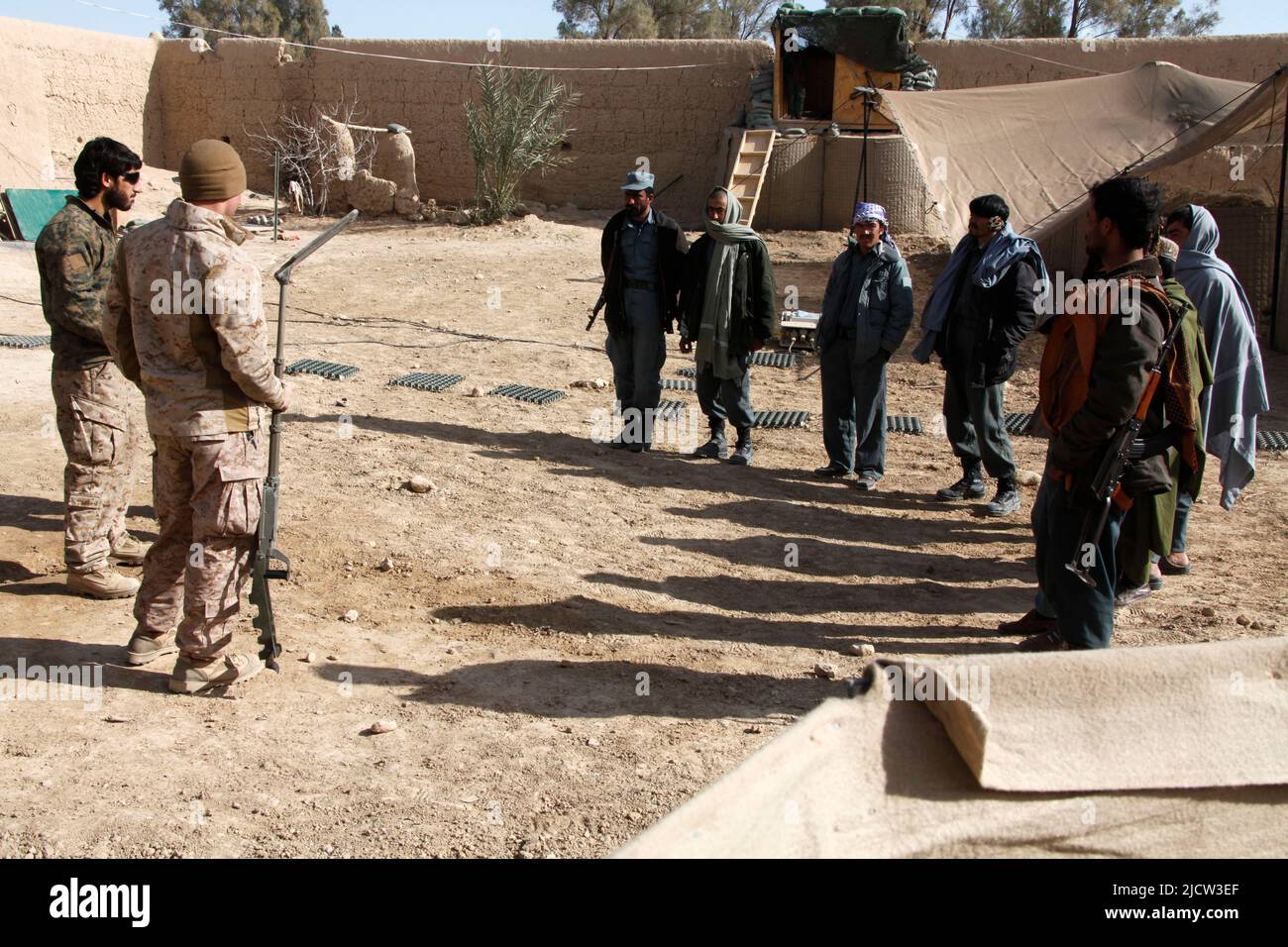 A U.S. Marine with the Police Advisory Team 2 (PAT 2) (left), 1st ...