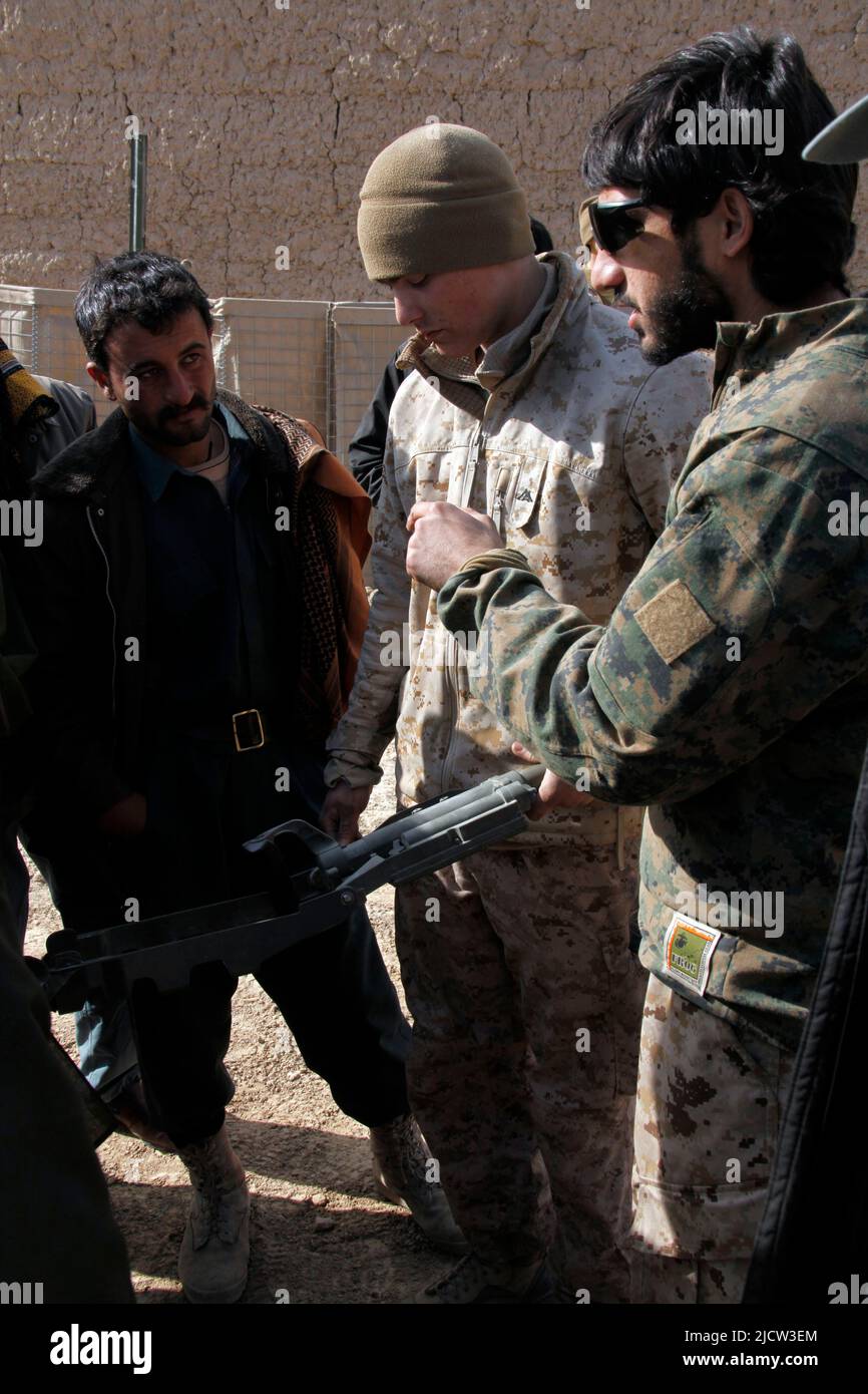 A U.S. Marine with the Police Advisory Team 2 (PAT 2) (center), 1st ...