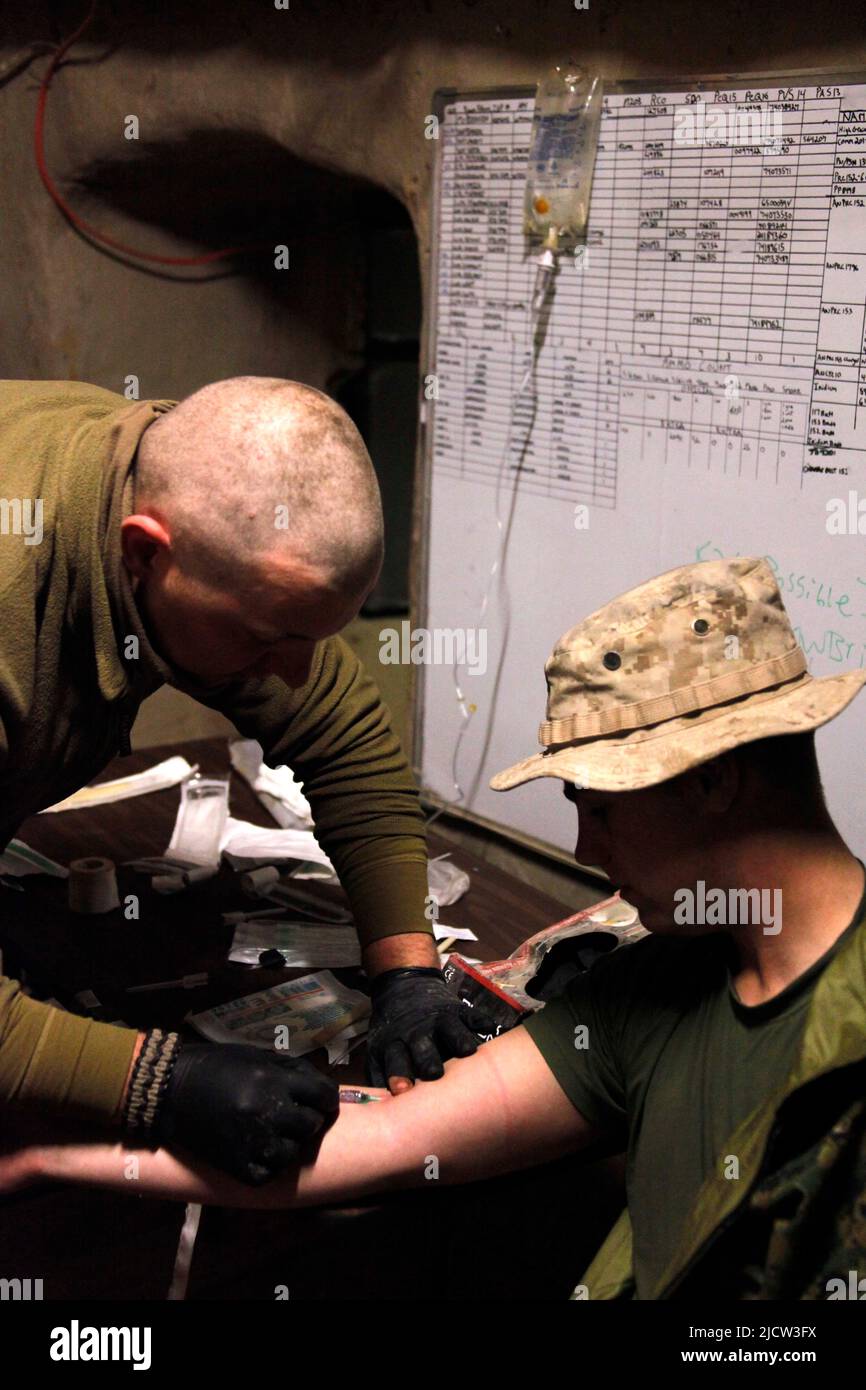 U.S. Navy Hospital Corpsman HM2 Matthew R. Godwin (left), with Police ...