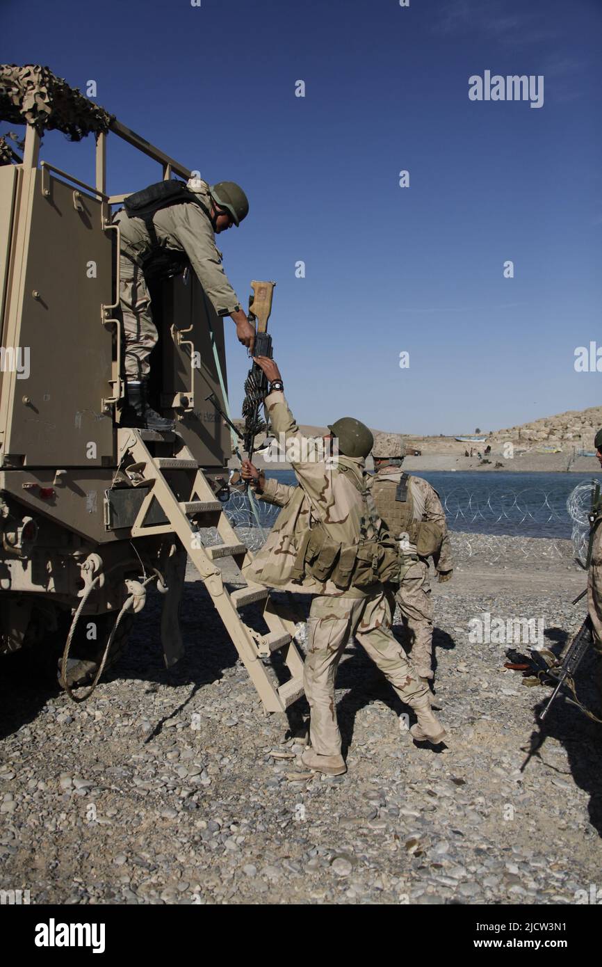 Afghan Task Force (ATF) soldiers offload from a Medium Tactical Vehicle ...