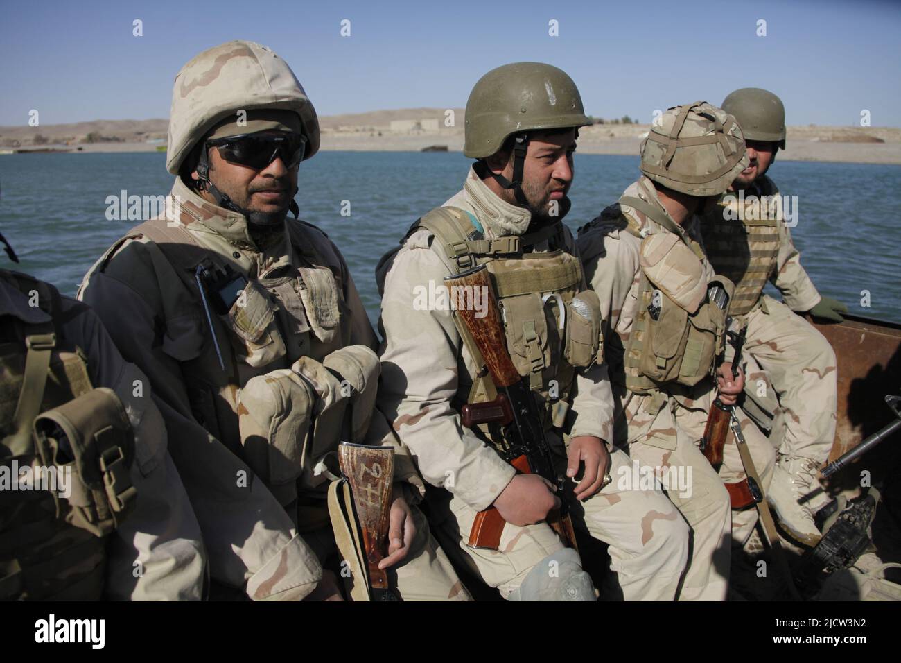 Afghan Task Force (ATF) soldiers cross the Helmond River on their way ...