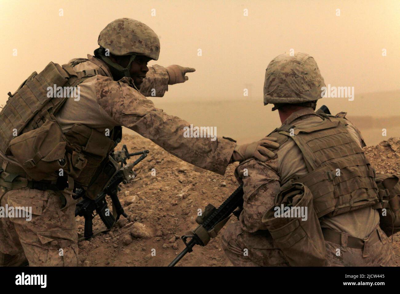 A U.S. Marine (left) with Weapons Company, 1st Battalion, 8th Marine ...