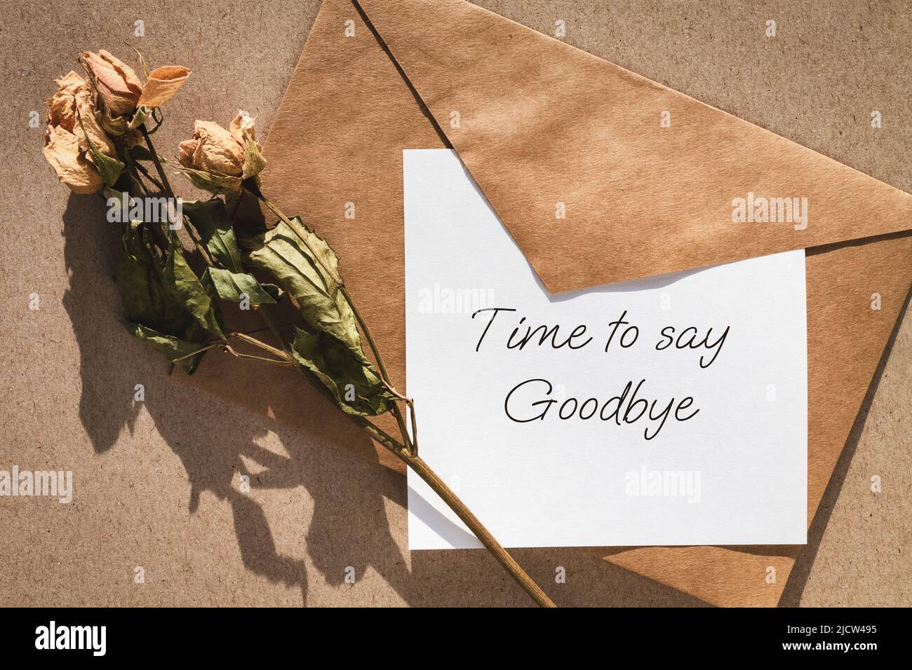 Time to say goodbye note, envelope and dry roses Stock Photo - Alamy