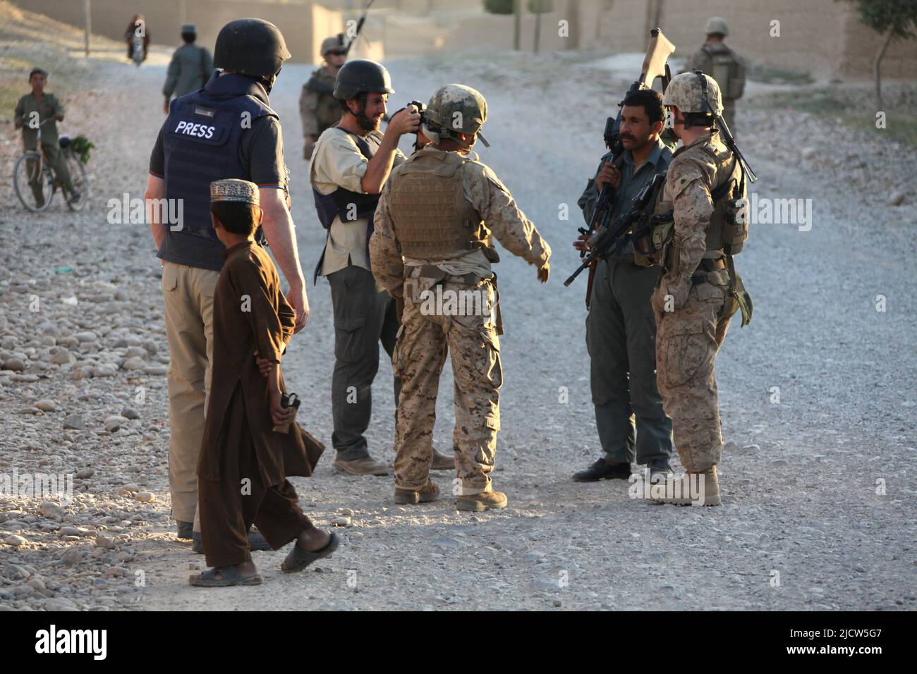 Ben Foley, center left, camera man, and Bernard Smith, left, reporter ...