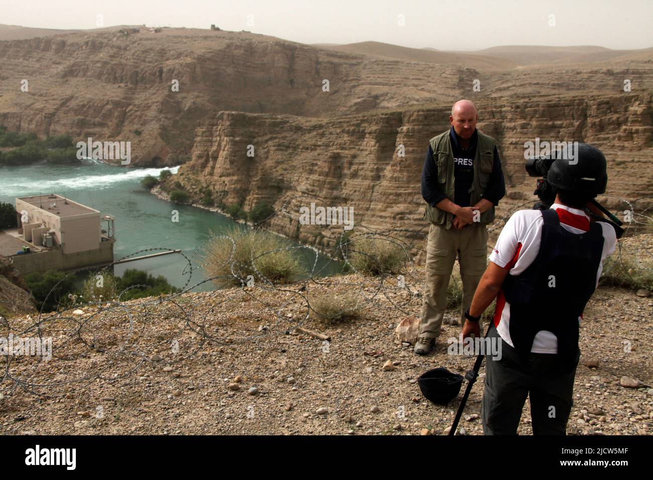 Bernard Smith, right, reporter, and Ben Foley, far right, cameraman ...