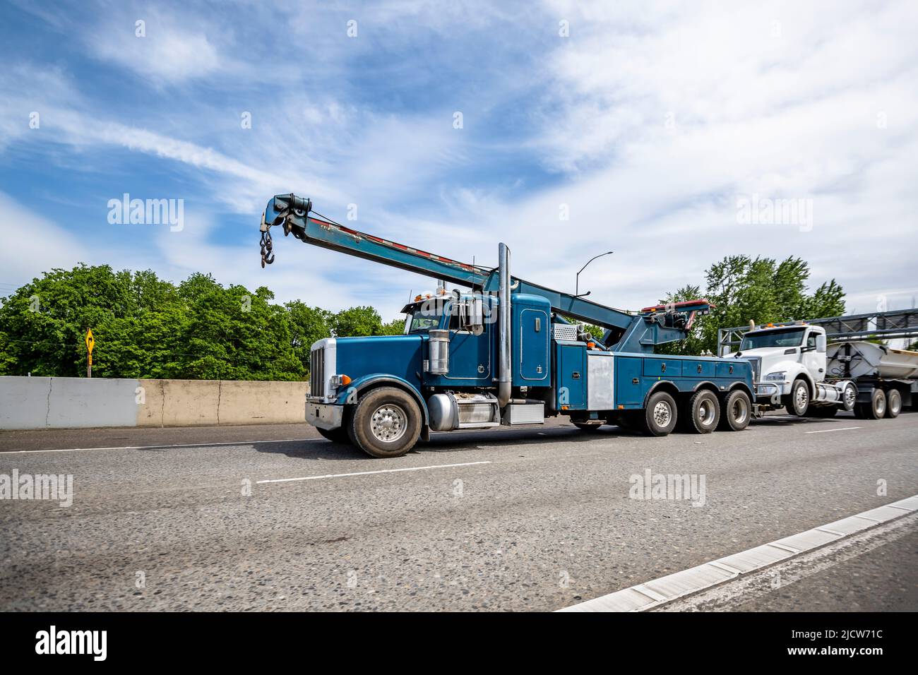 Powerful mobile helper heavy duty blue big rig towing semi truck ...