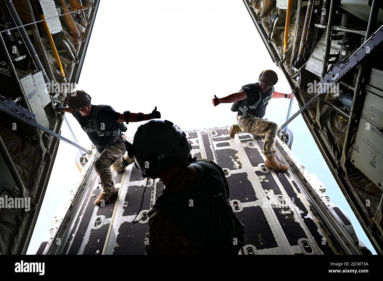 U.S. Army jumpmasters look for the drop zone prior to a static line ...