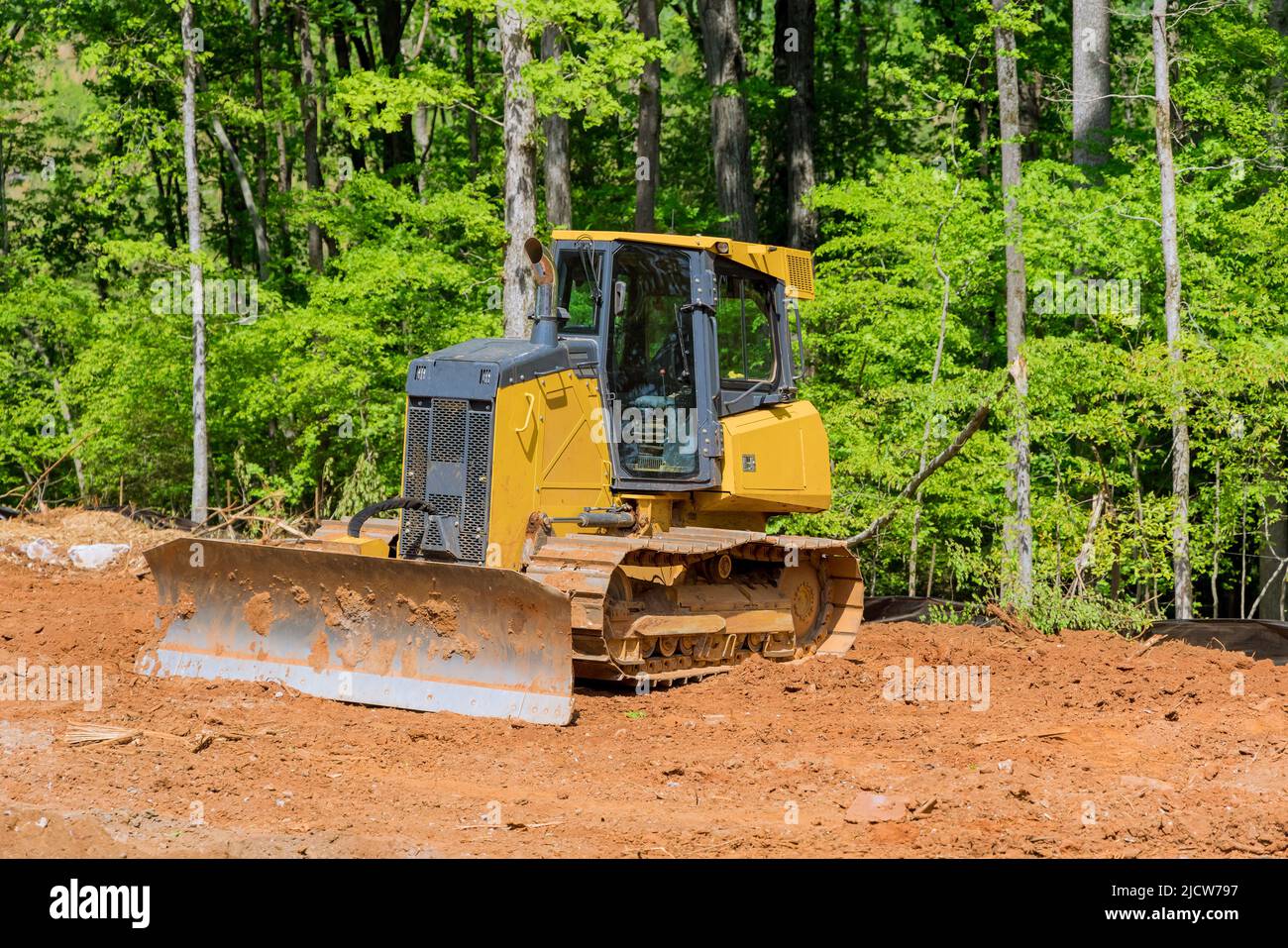 Excavators during landscaping works at construction site Stock Photo ...