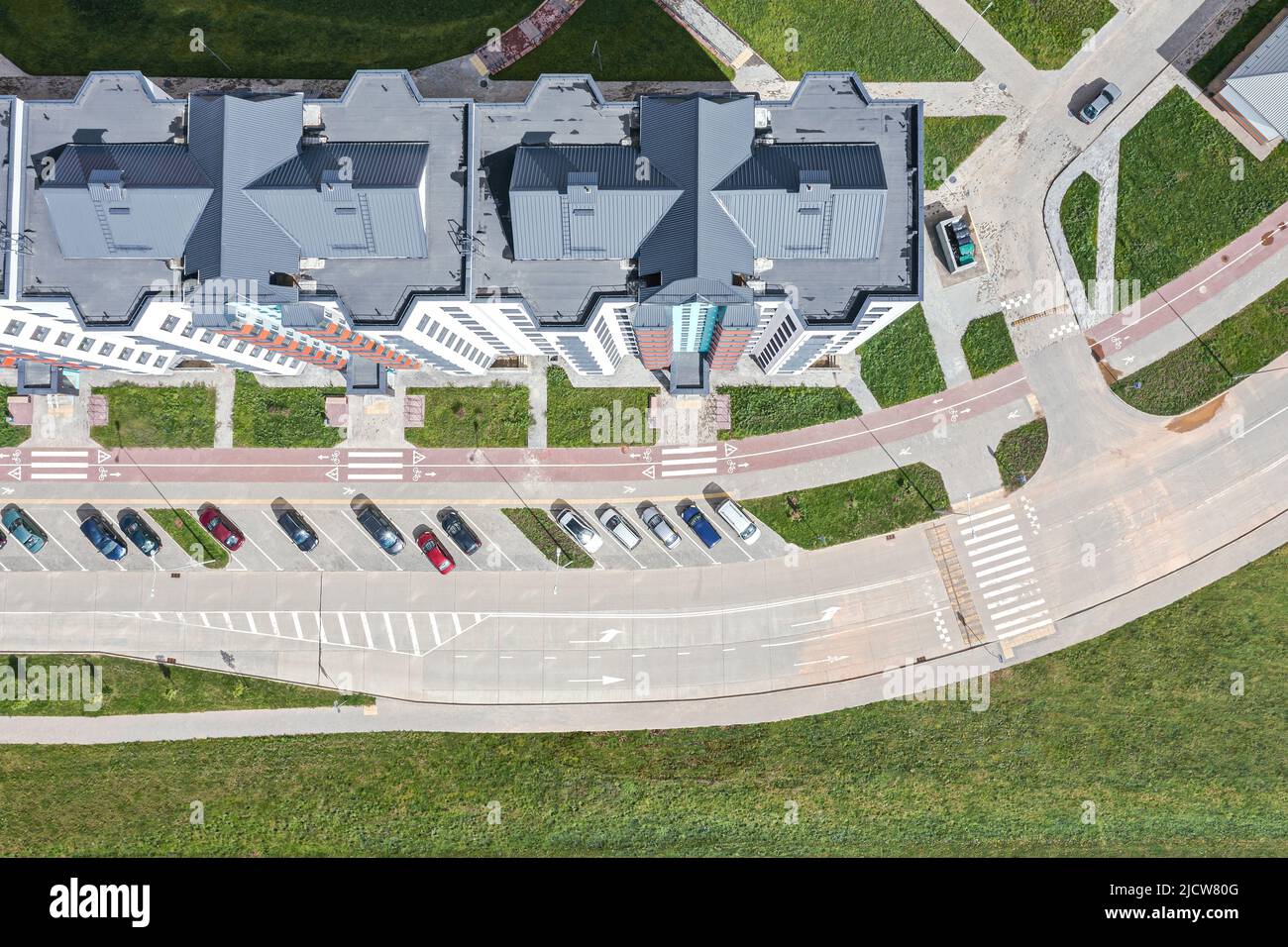 high-rise residential building with outdoor parking lot. aerial top ...
