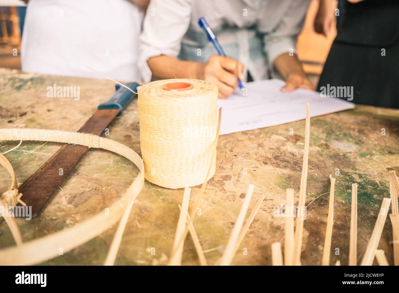 Production of professional handicrafts. Woman writing down details ...