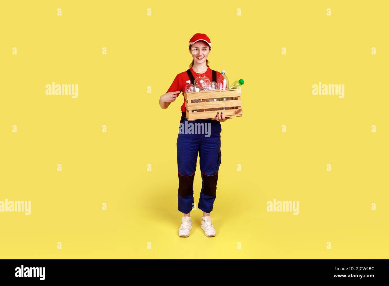 Full length portrait of positive optimistic worker woman standing and ...