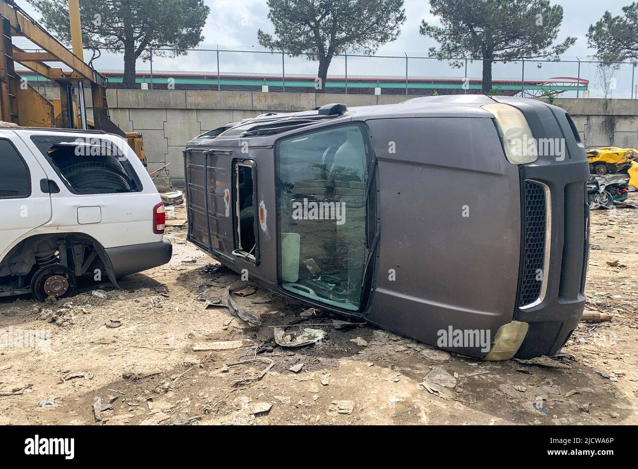 Overturned car on junk yard, automobile on car dump after accident ...