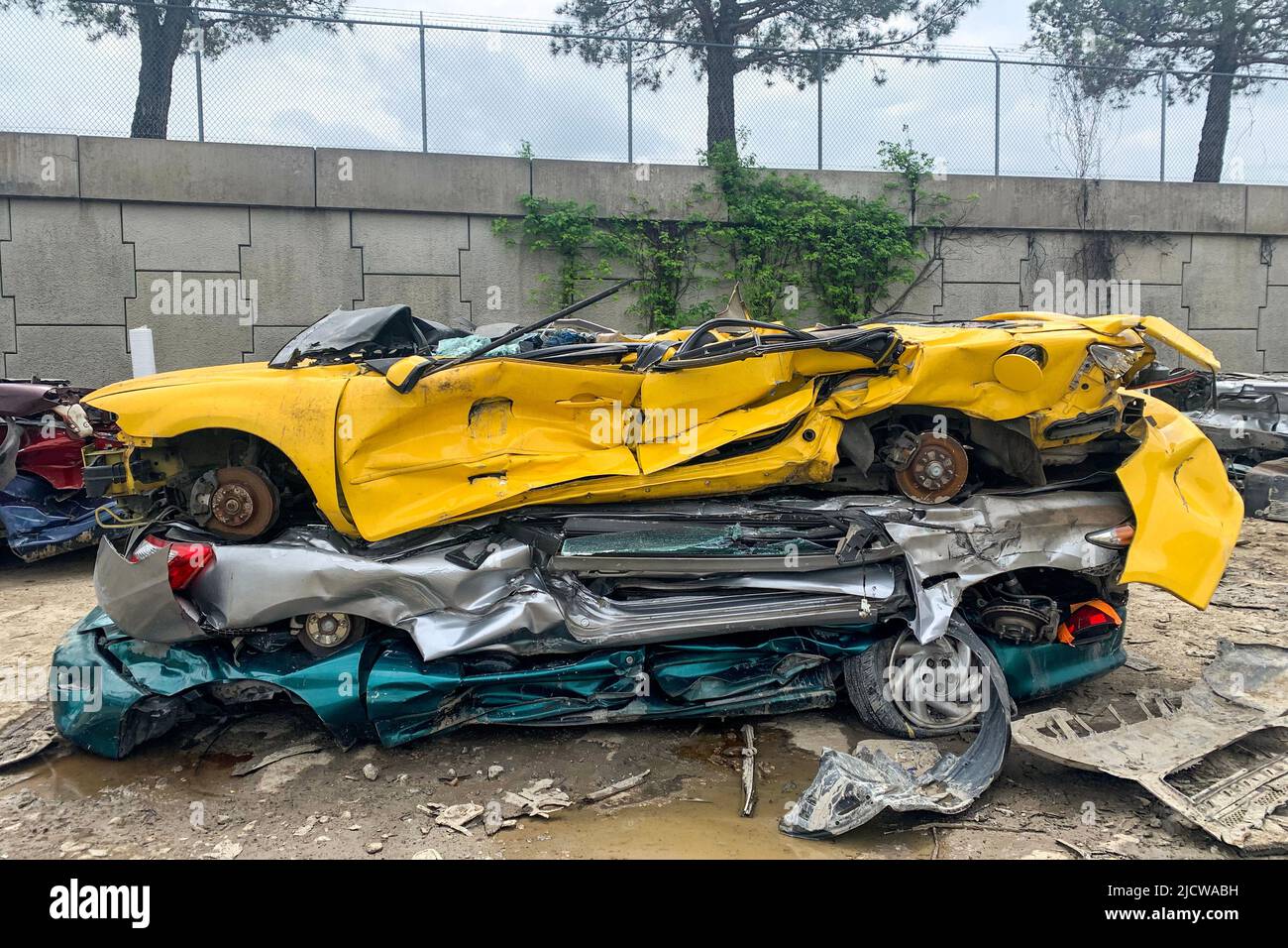 Pile of shredded cars to be shredded at a recycling plant, stack of ...