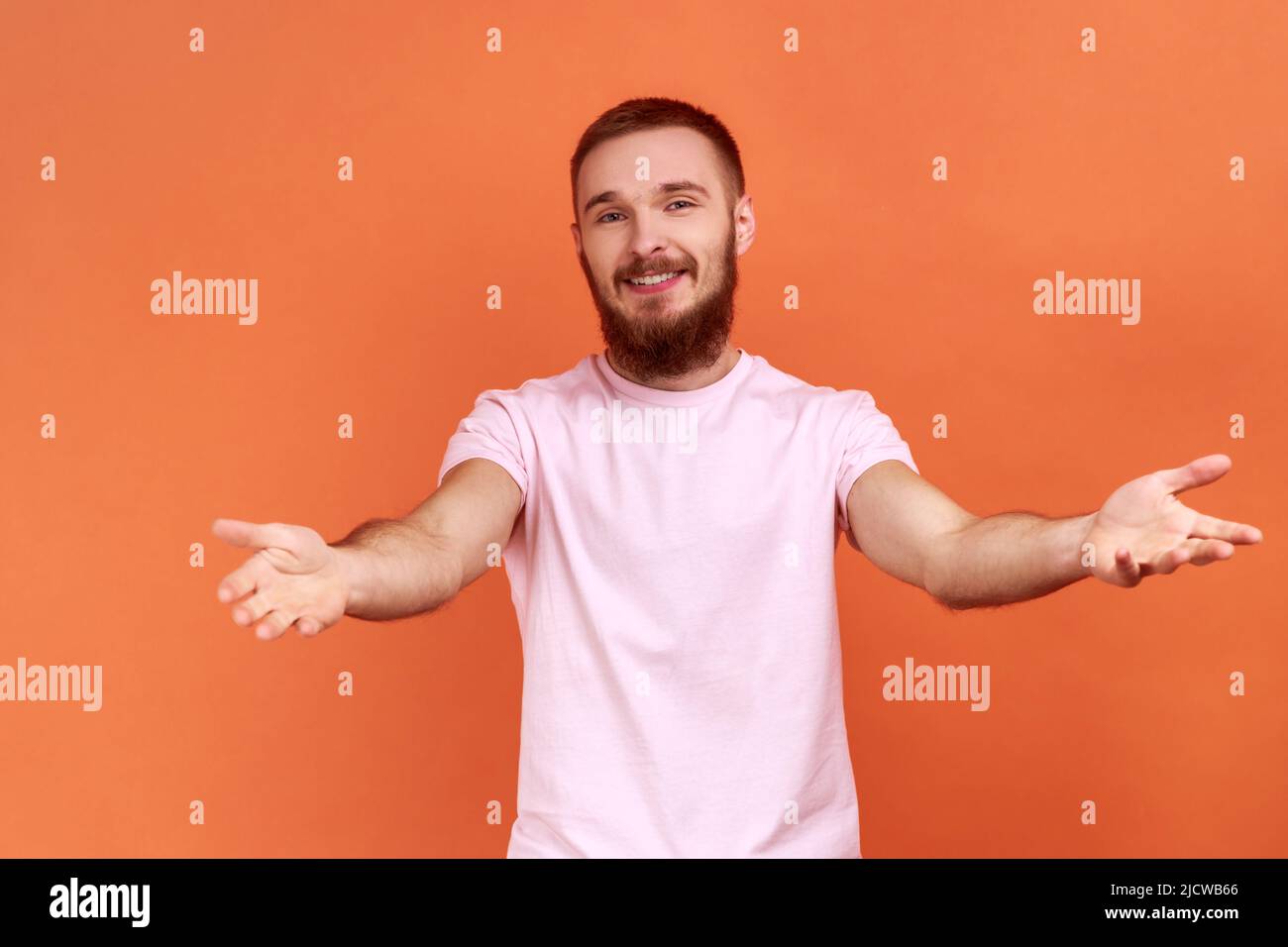 Welcome, wide open hug. Portrait of bearded man stretching hands to ...