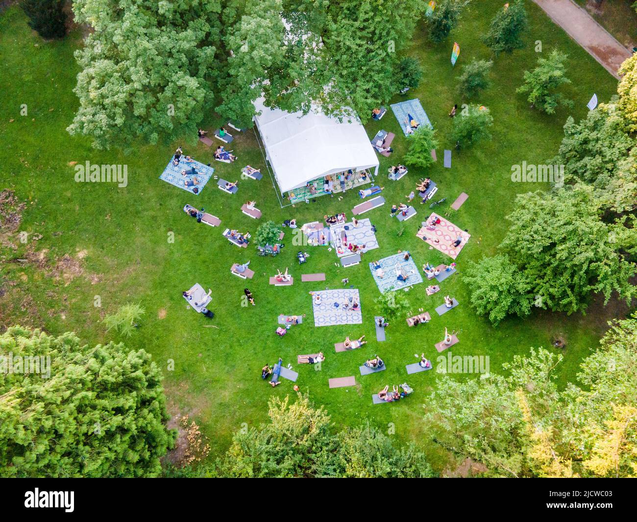 people laying down at city public park overhead top view outside ...