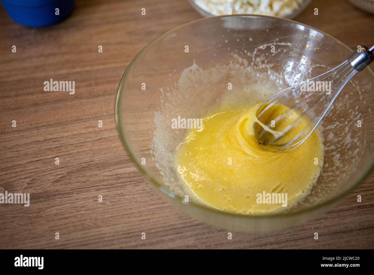 mixing eggs in bowl close up cooking concept Stock Photo - Alamy