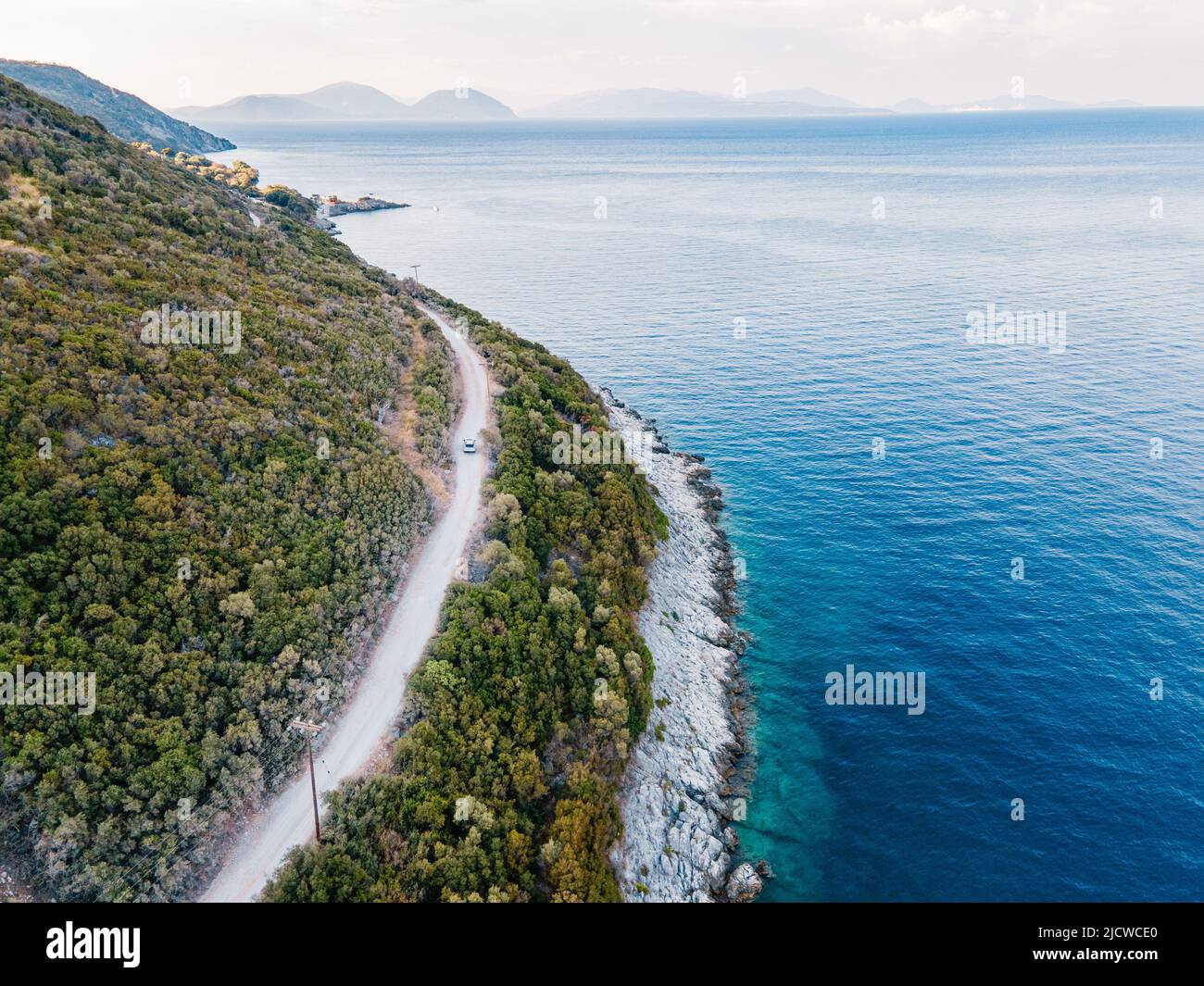 overhead view of car moving by road next to sea shore copy space Stock ...