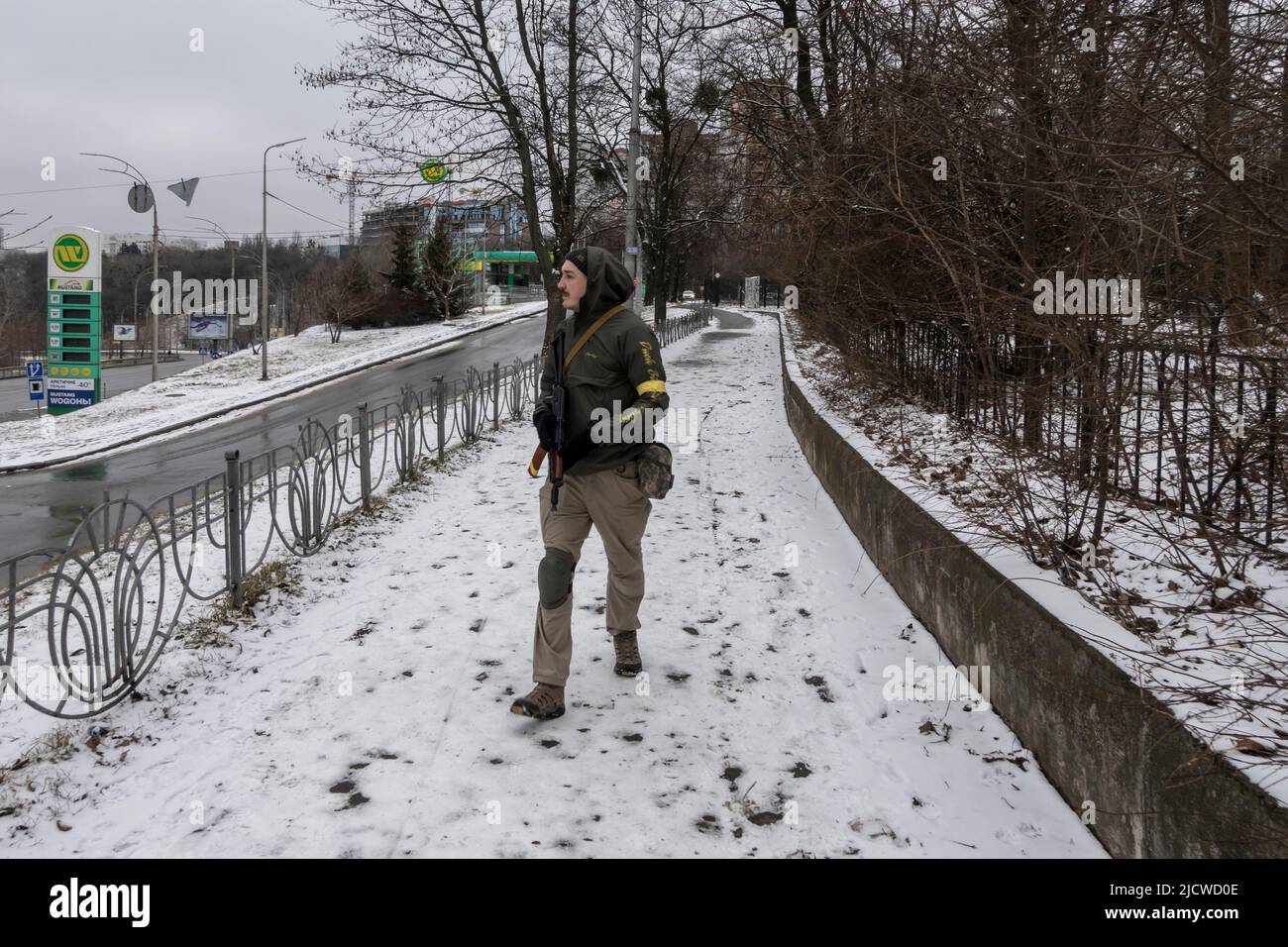 KYIV, UKRAINE 01 March. A member of Kyiv's civil defense walks with a ...